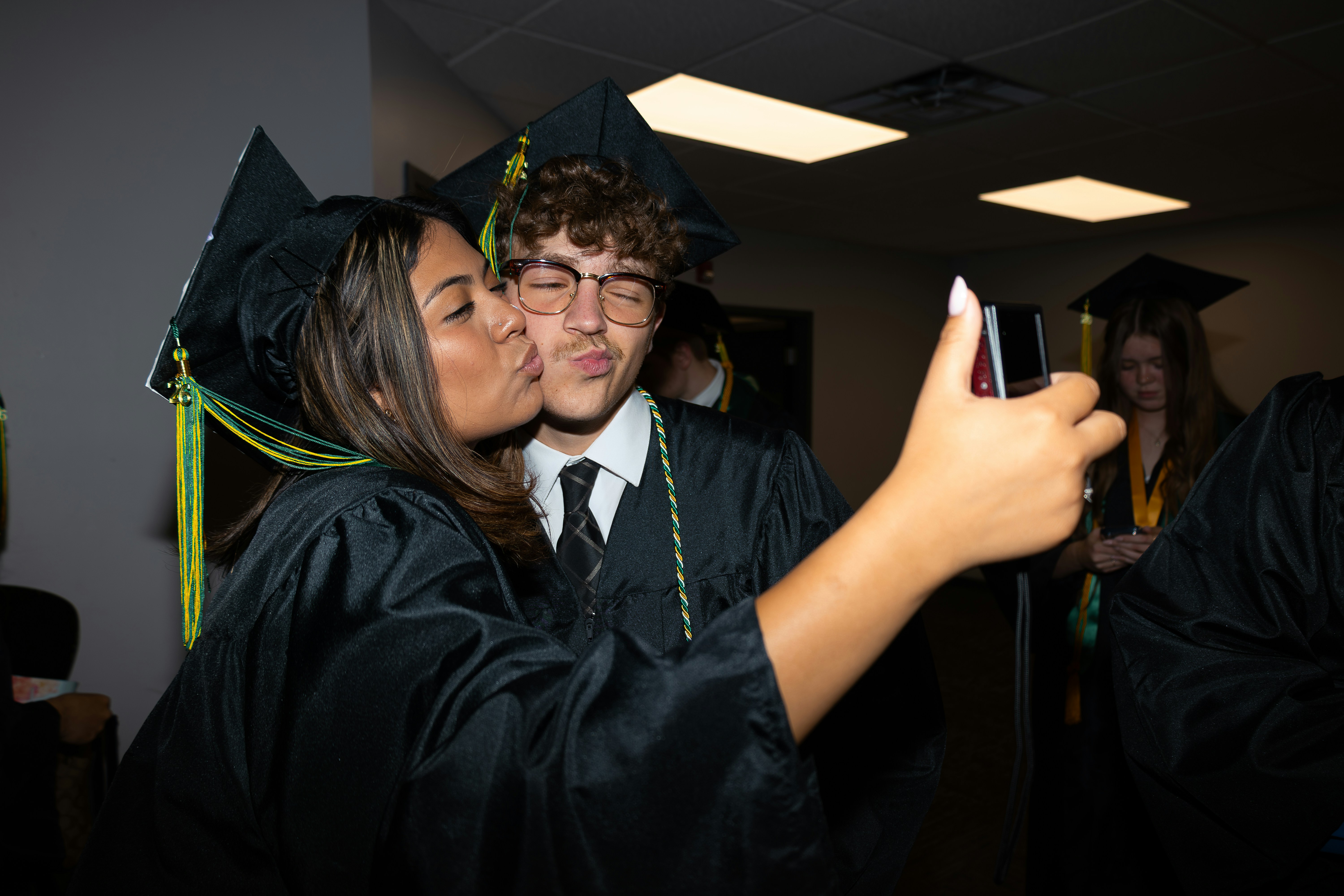 Selfie Celebration: Cheek-to-cheek Graduation Moment