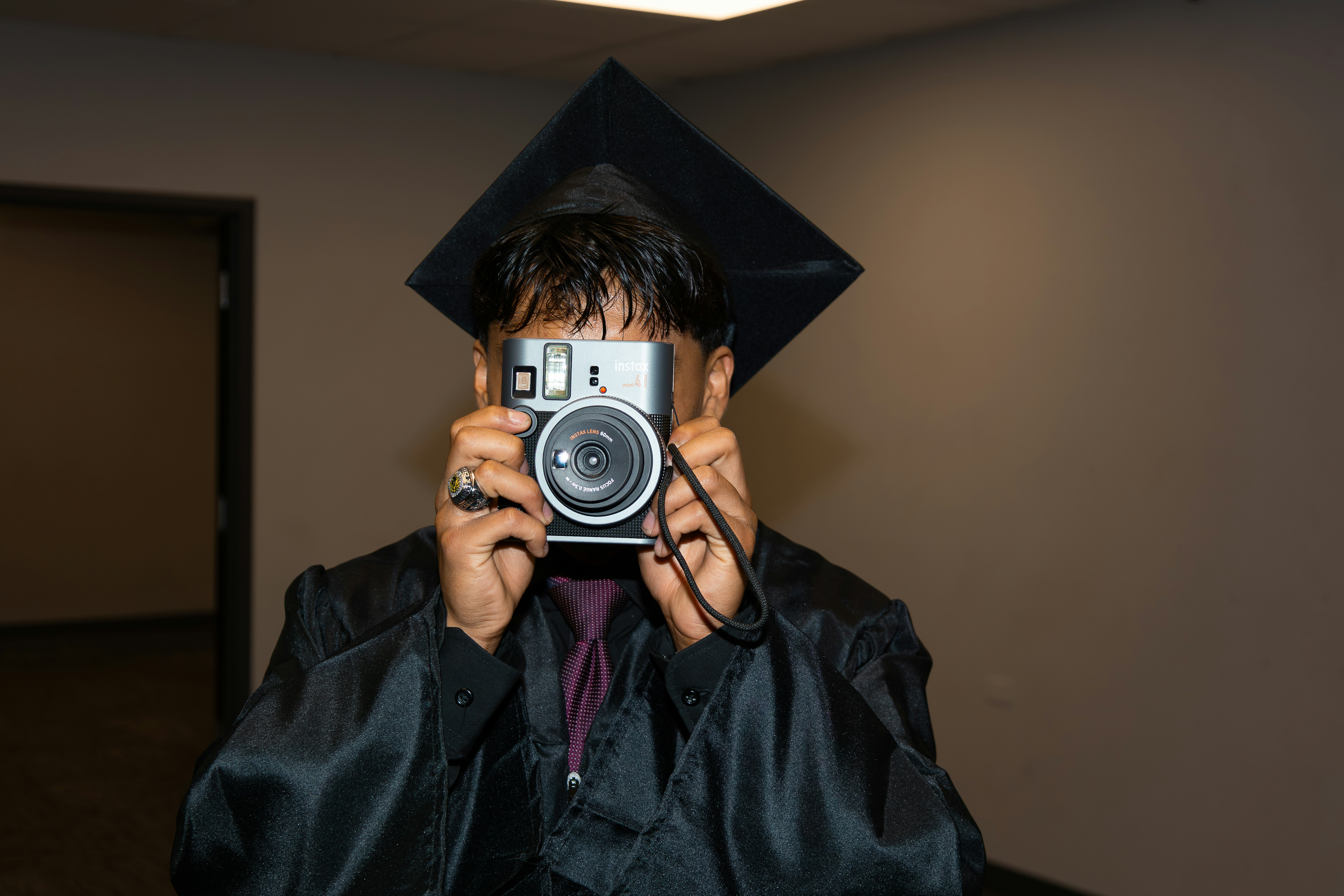 Graduation Portrait: The Graduate with a Compact Moment
