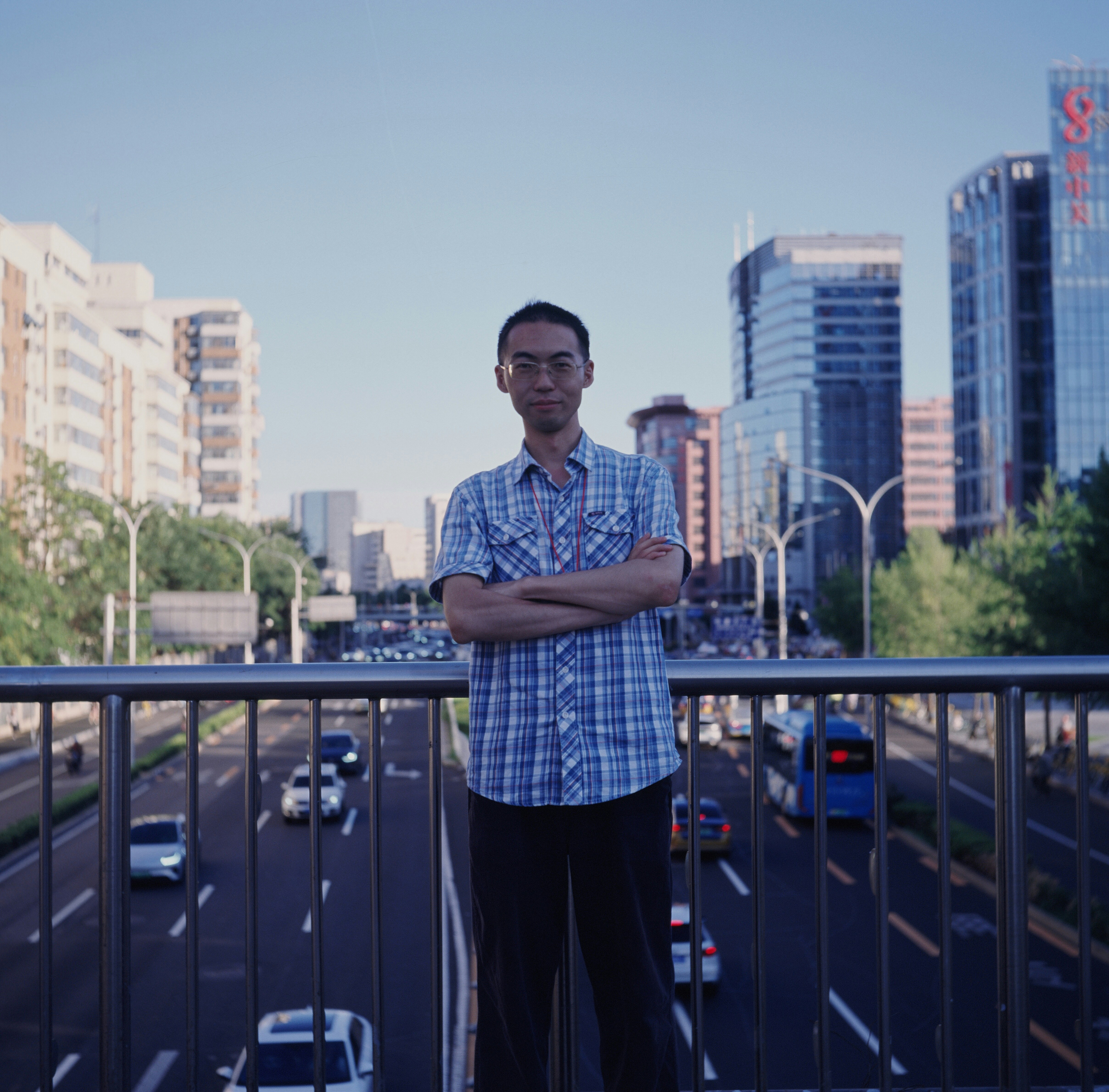 Crossing the City: A Confident Stance Over a Busy Horizon