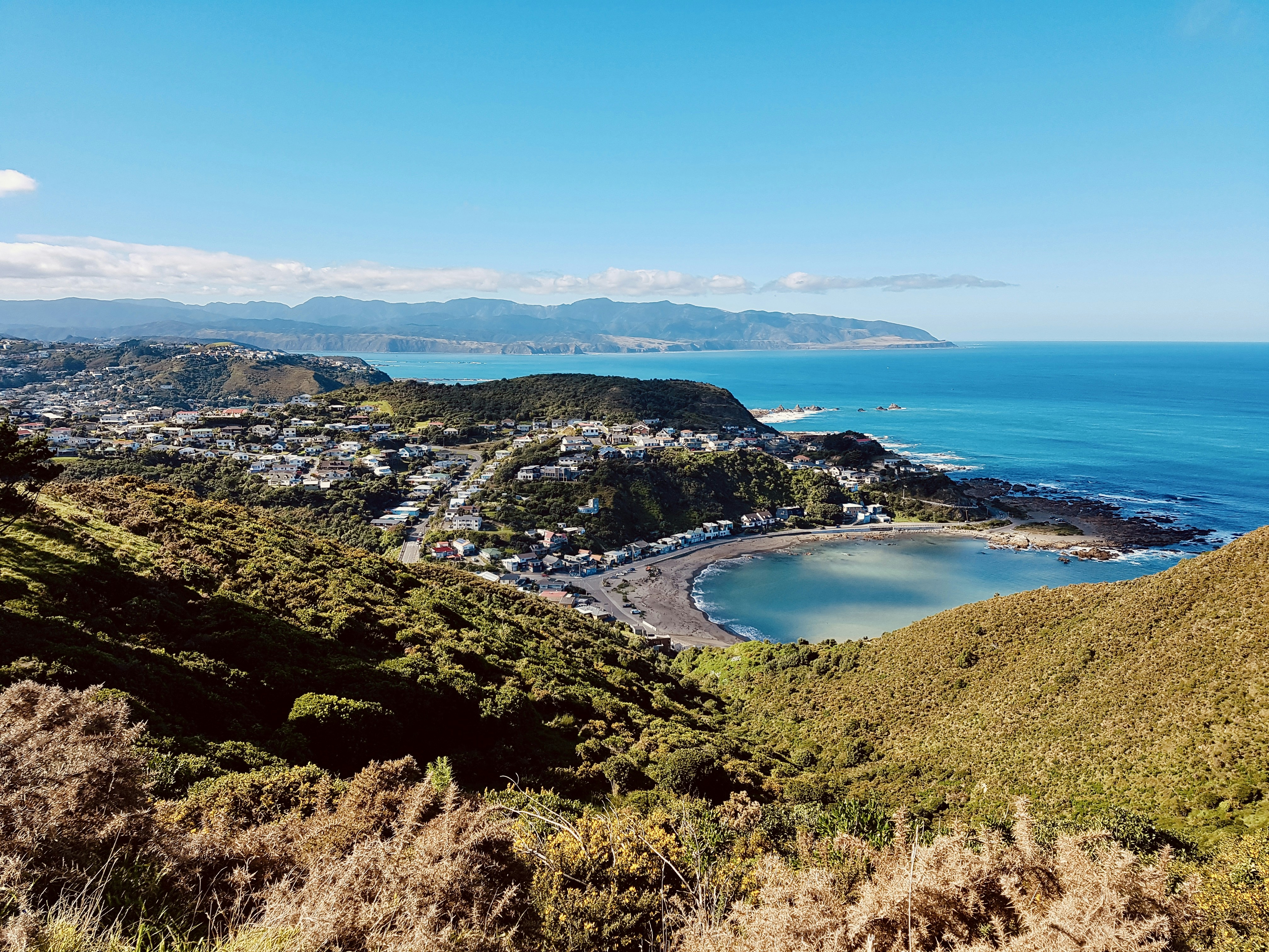 Coastal Village Fringed by Golden Hills and Tidal Lagoon