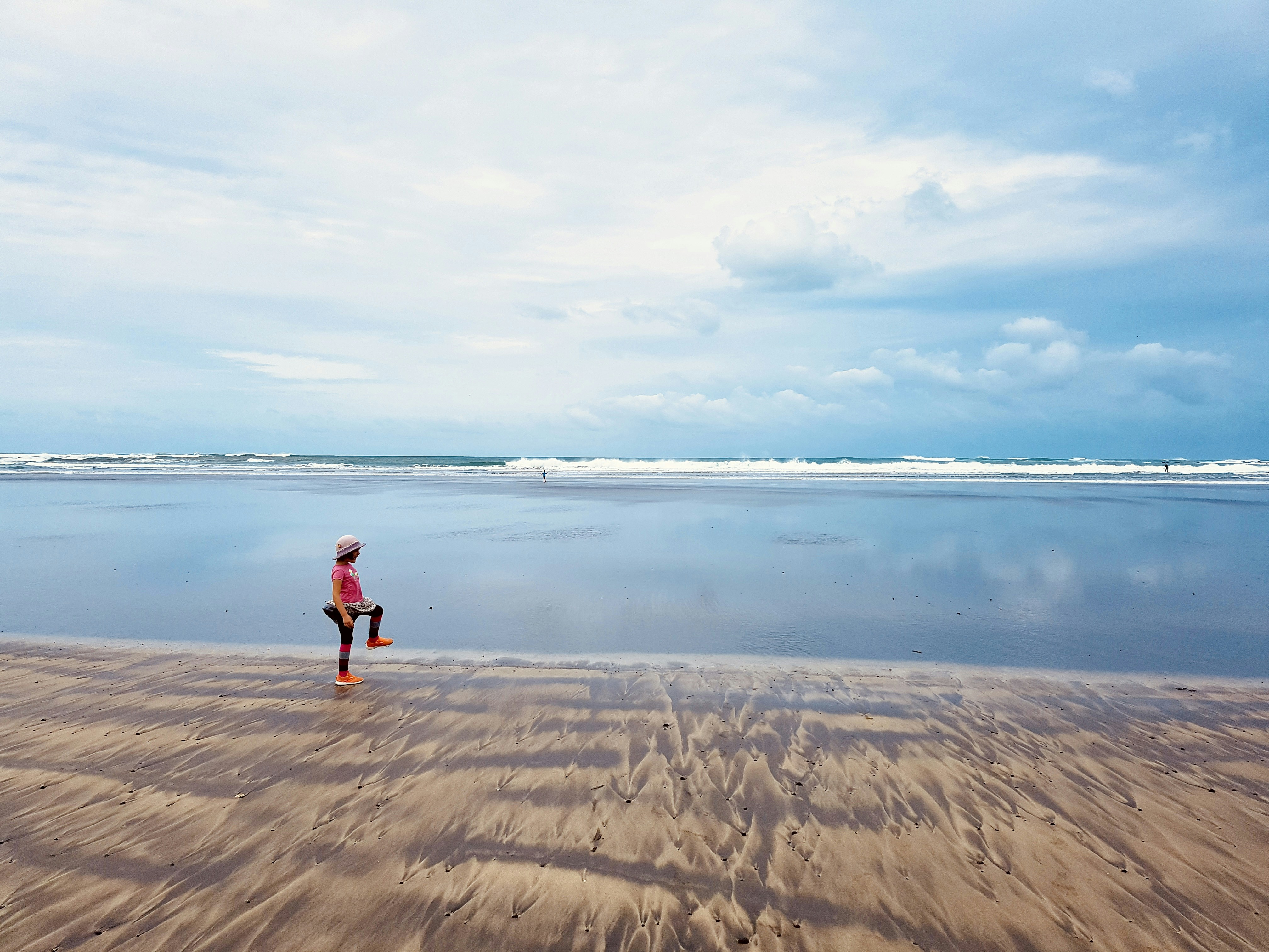Footprints of a Lone Runner across Tidal Glass
