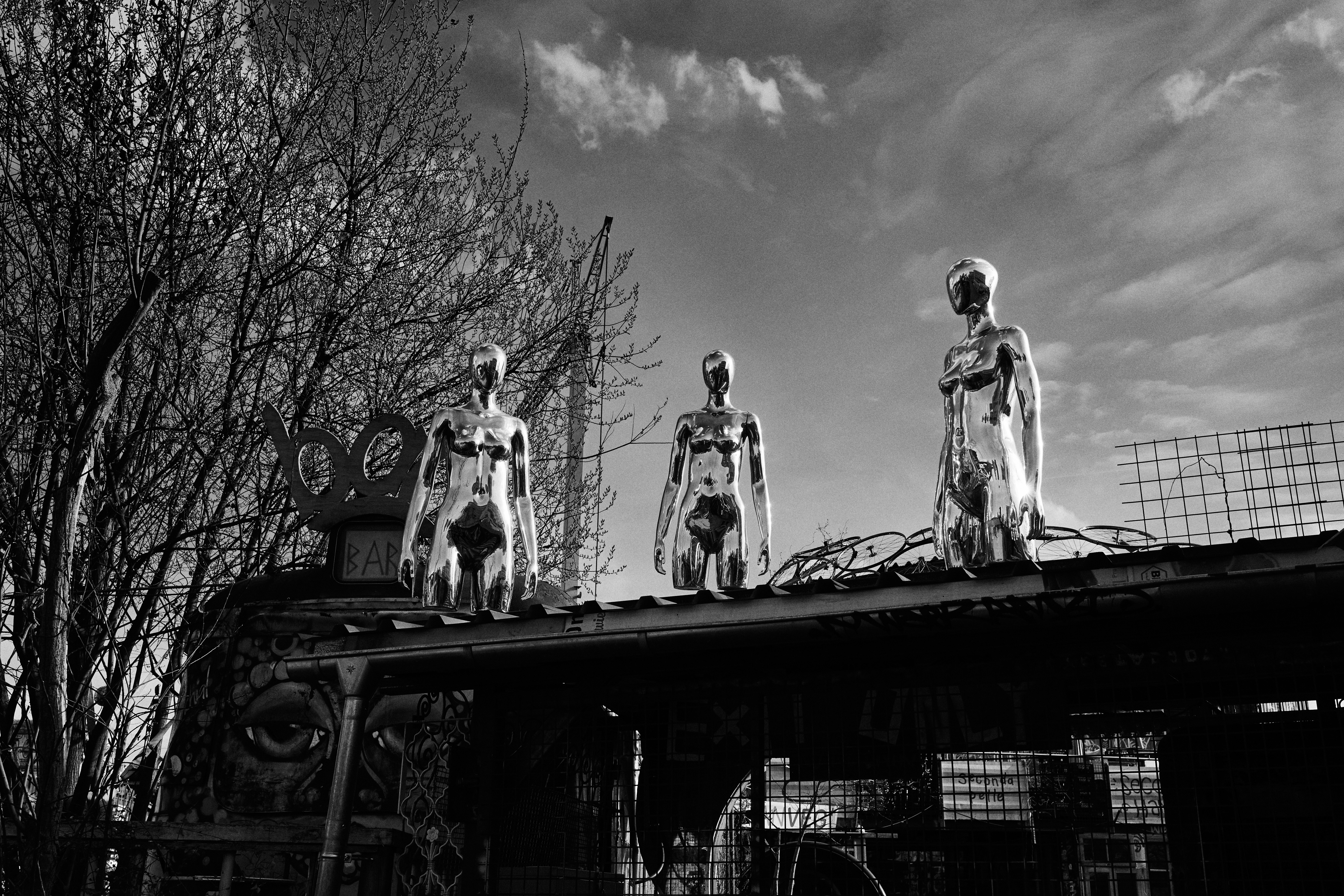 Statues on the Distant Roof: A Quiet Postcard of Decay and Light
