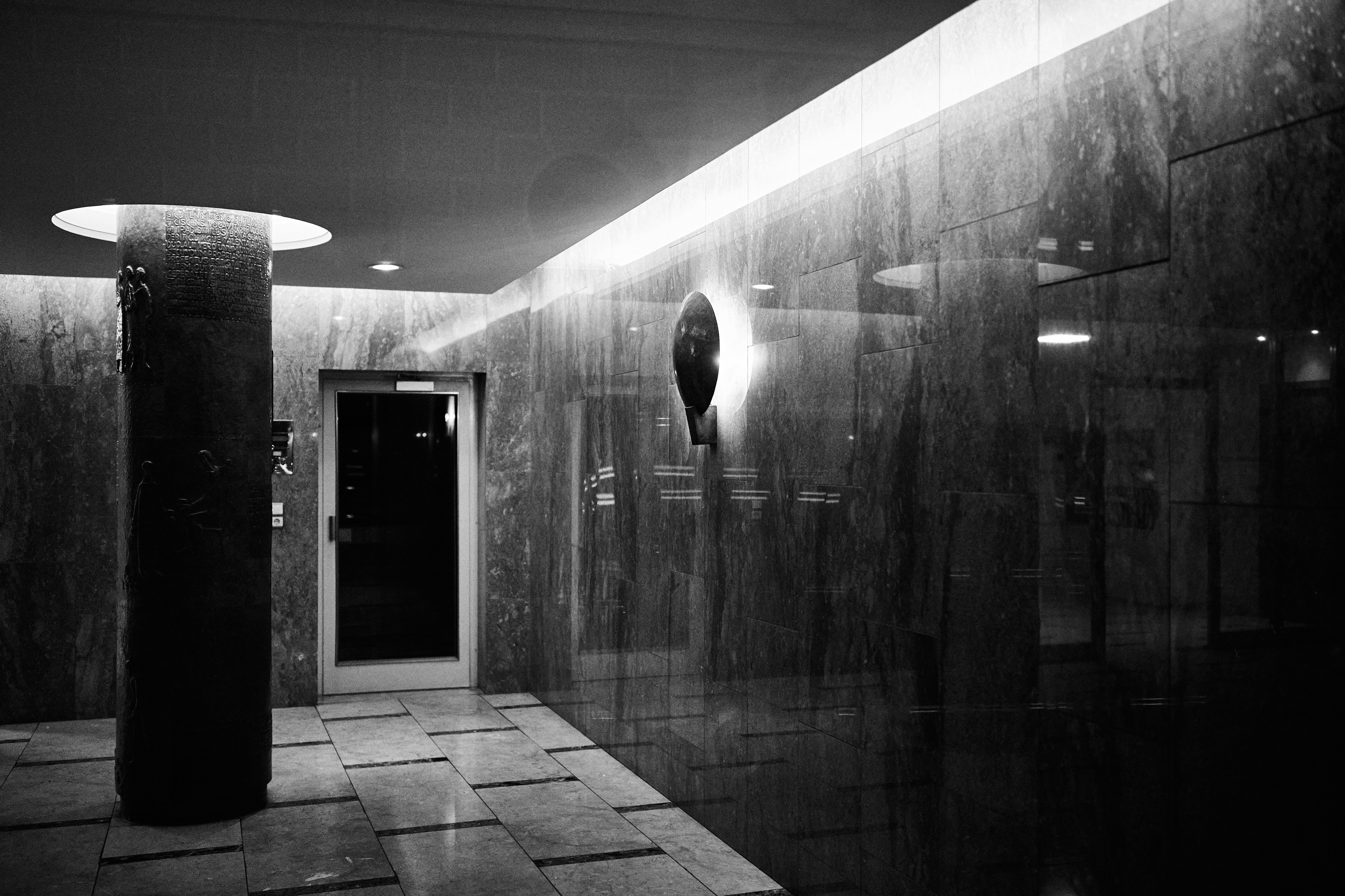 Echo in the Marble Corridor: A Lone Portrait in Monochrome