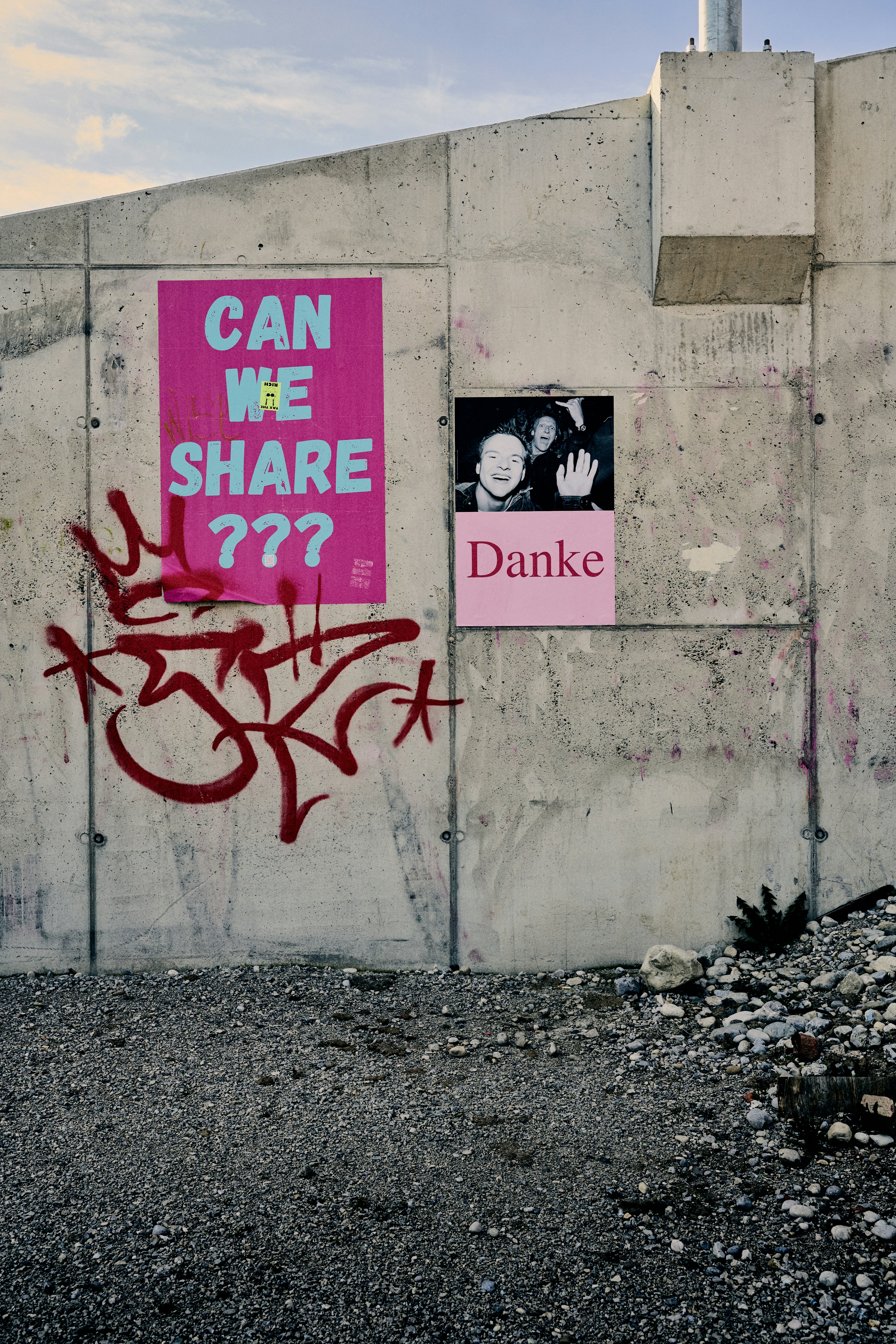 Pink Signage and Graffiti on a Rough Concrete Wall