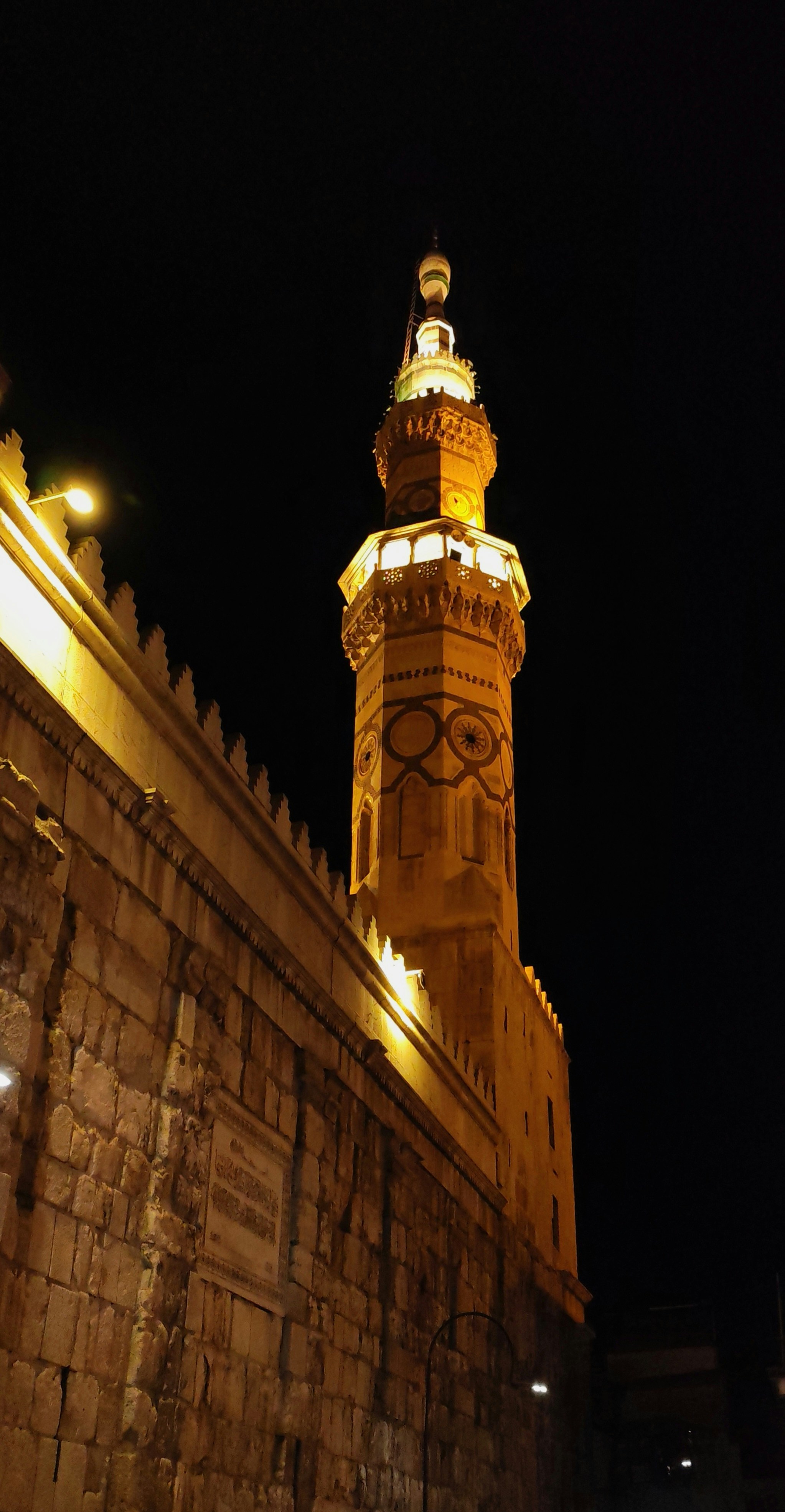 Luminous Minaret Rising Above Moonlit Stones