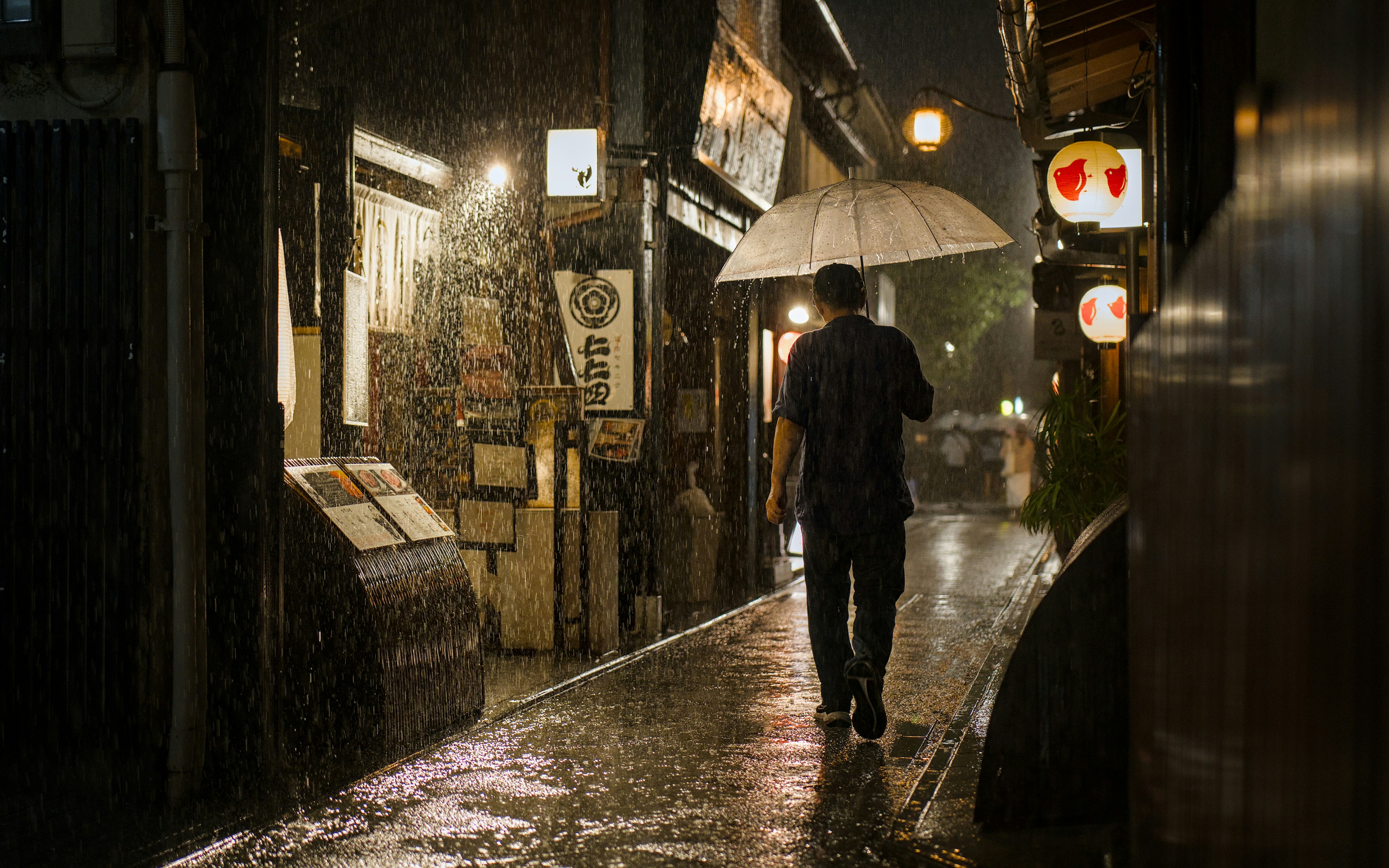 Umbrella in the Rain: A Quiet Walk Through Neon Alley