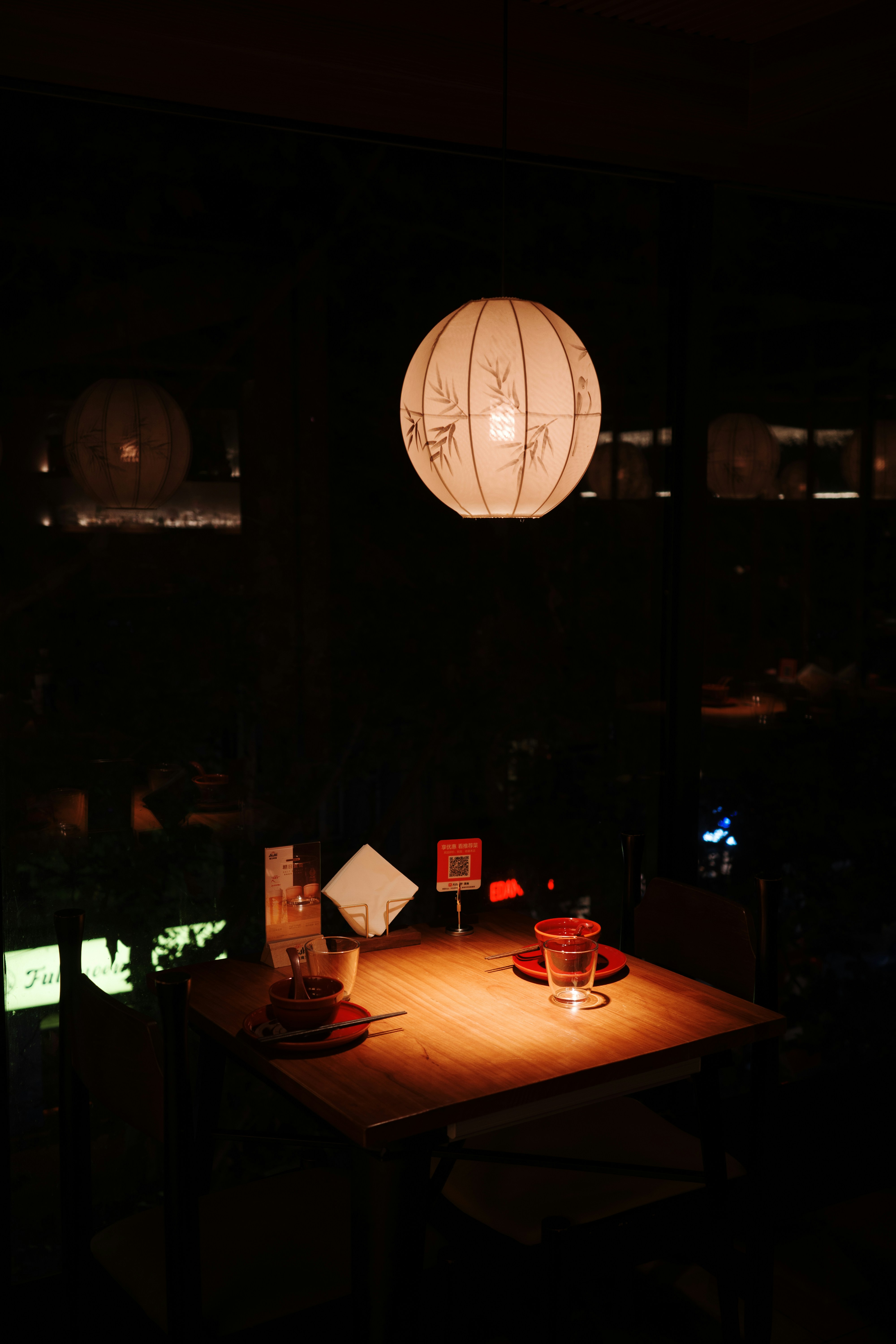 Warm Lantern Glow Over a Quiet Dining Table