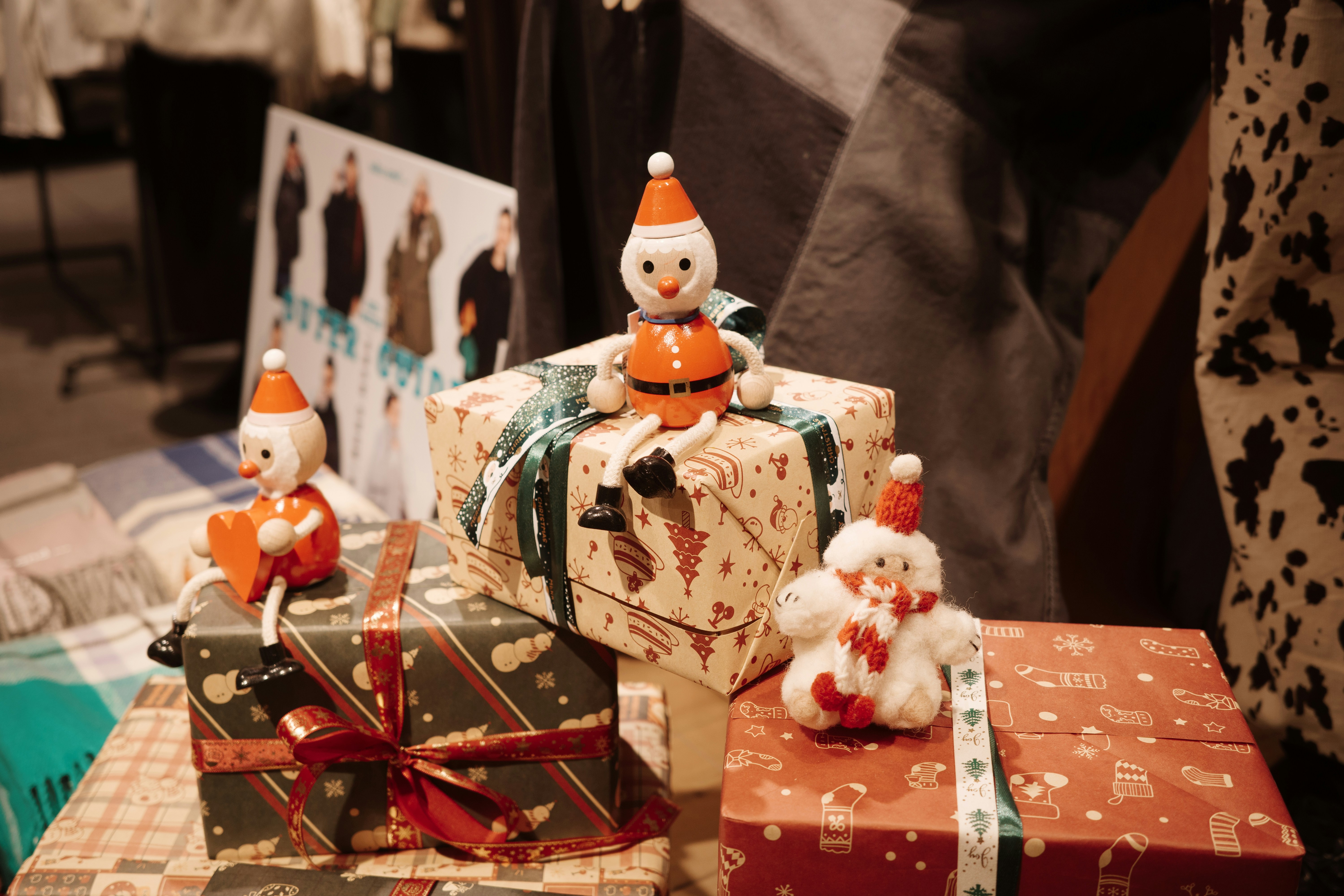 Gifting Joy: Tiny Snowmen Guard a Stack of Festive Presents