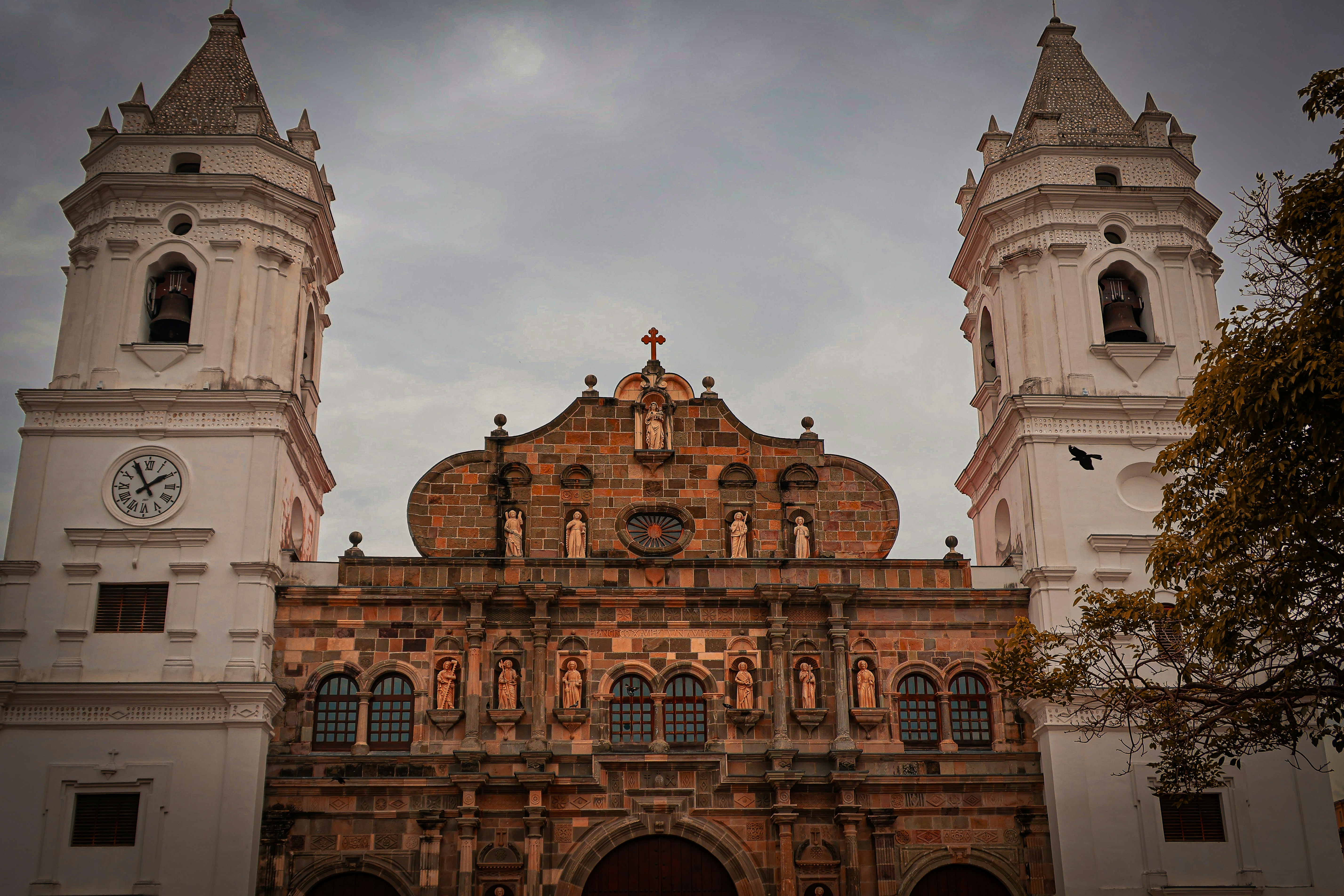 Facade of a grand colonial church framed by twin bell towers