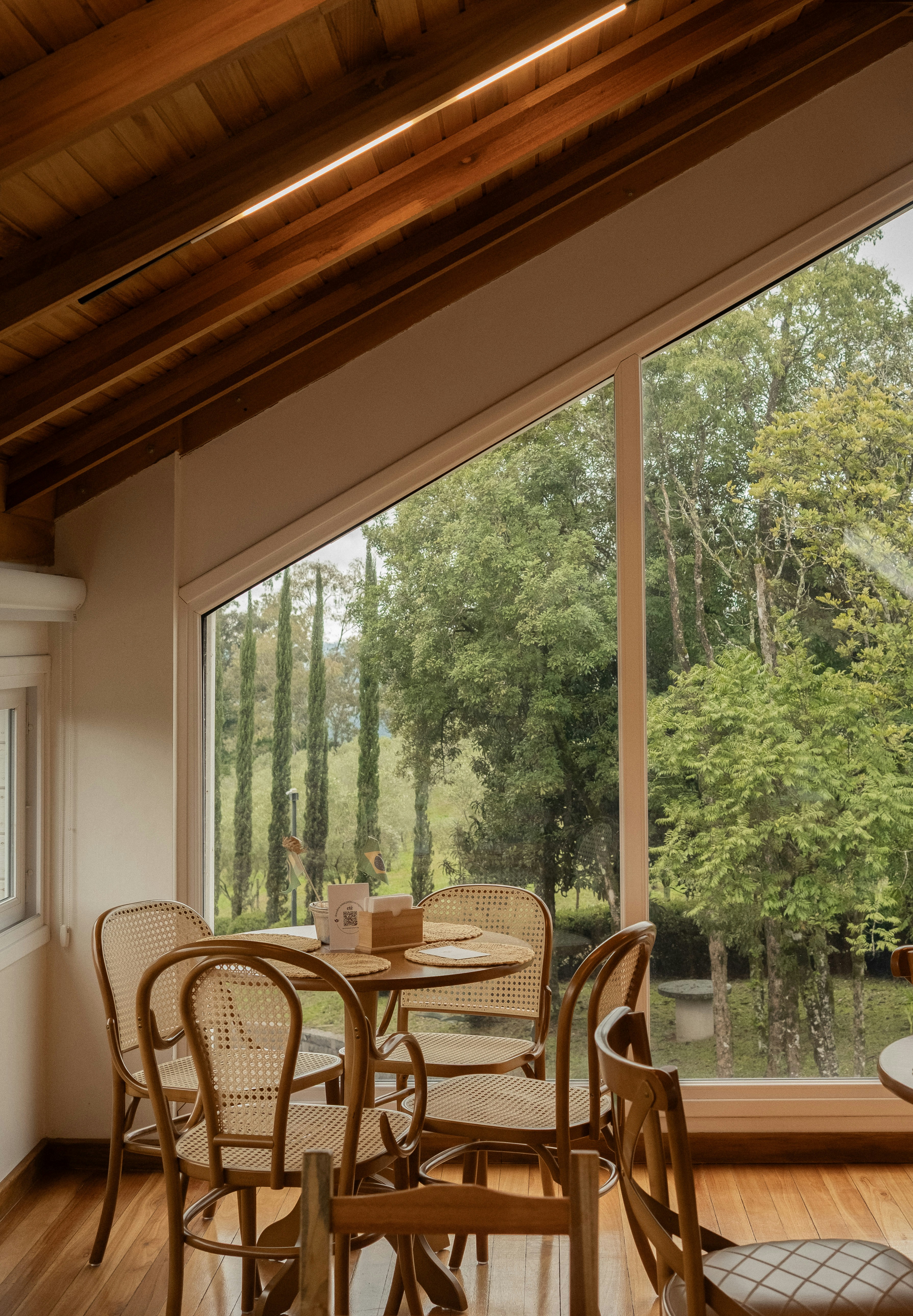 Sunlit Café Corner Framed by Large Windows