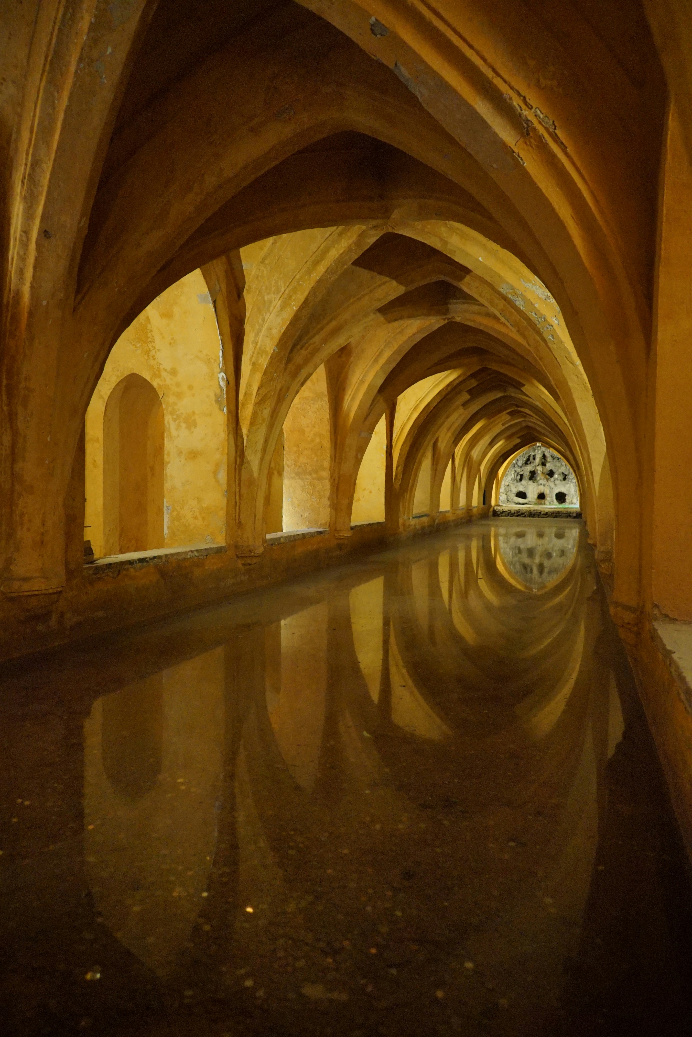 Reflections in an Ancient Arcaded Corridor