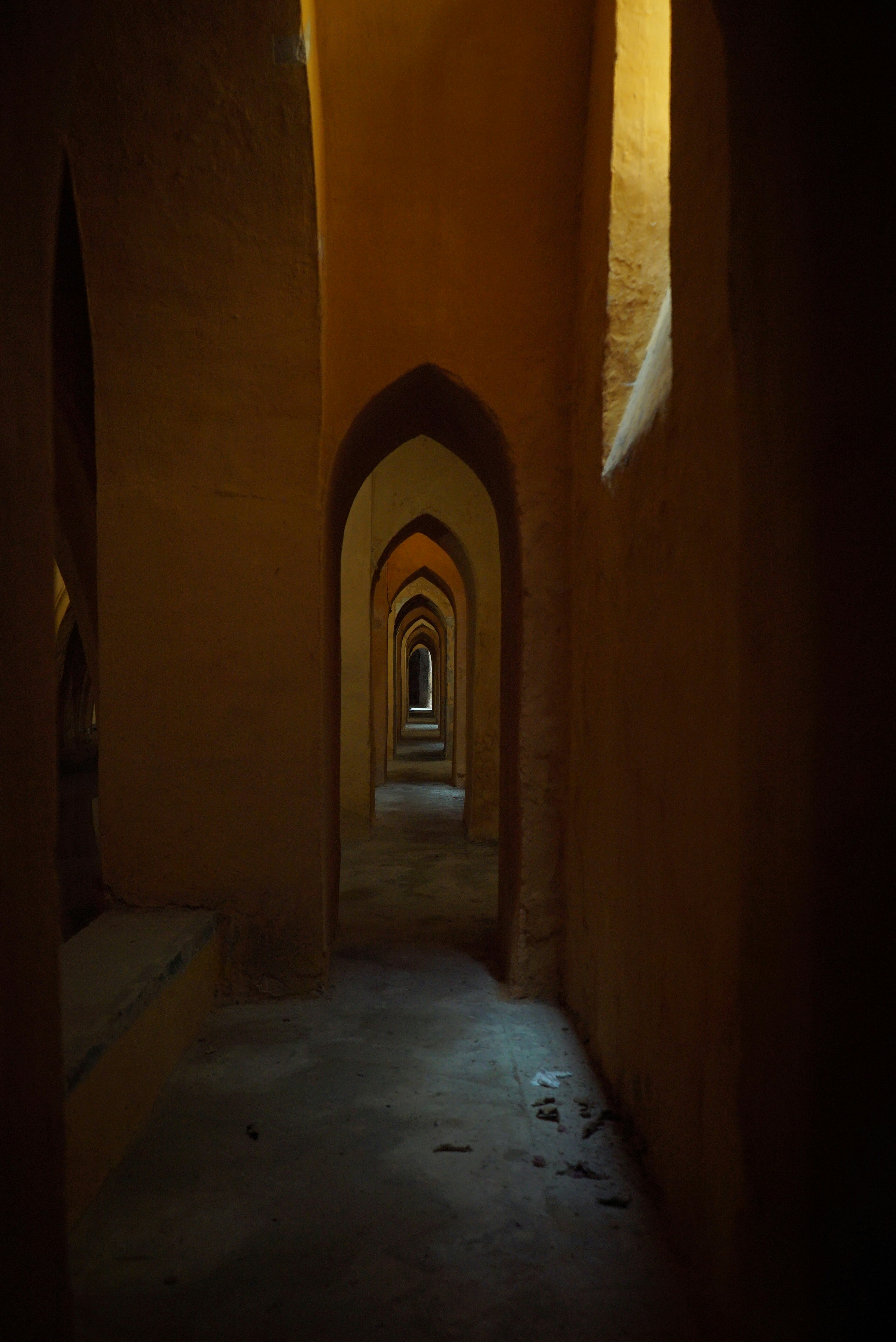 A Flicker Through Archways: Dim Corridor of Repose