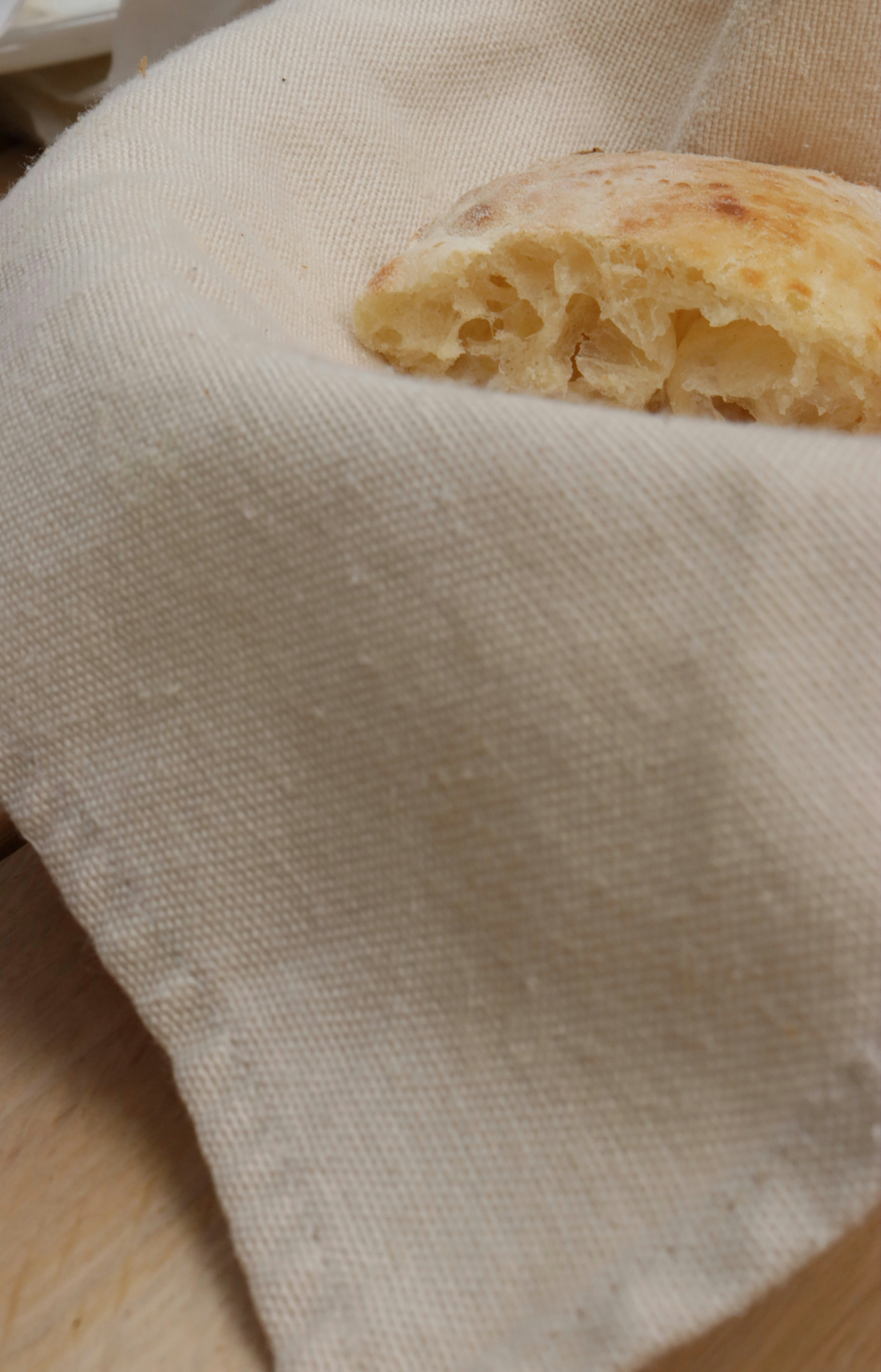 Crusty Bite on Quiet Linen: A Close-Read of Texture