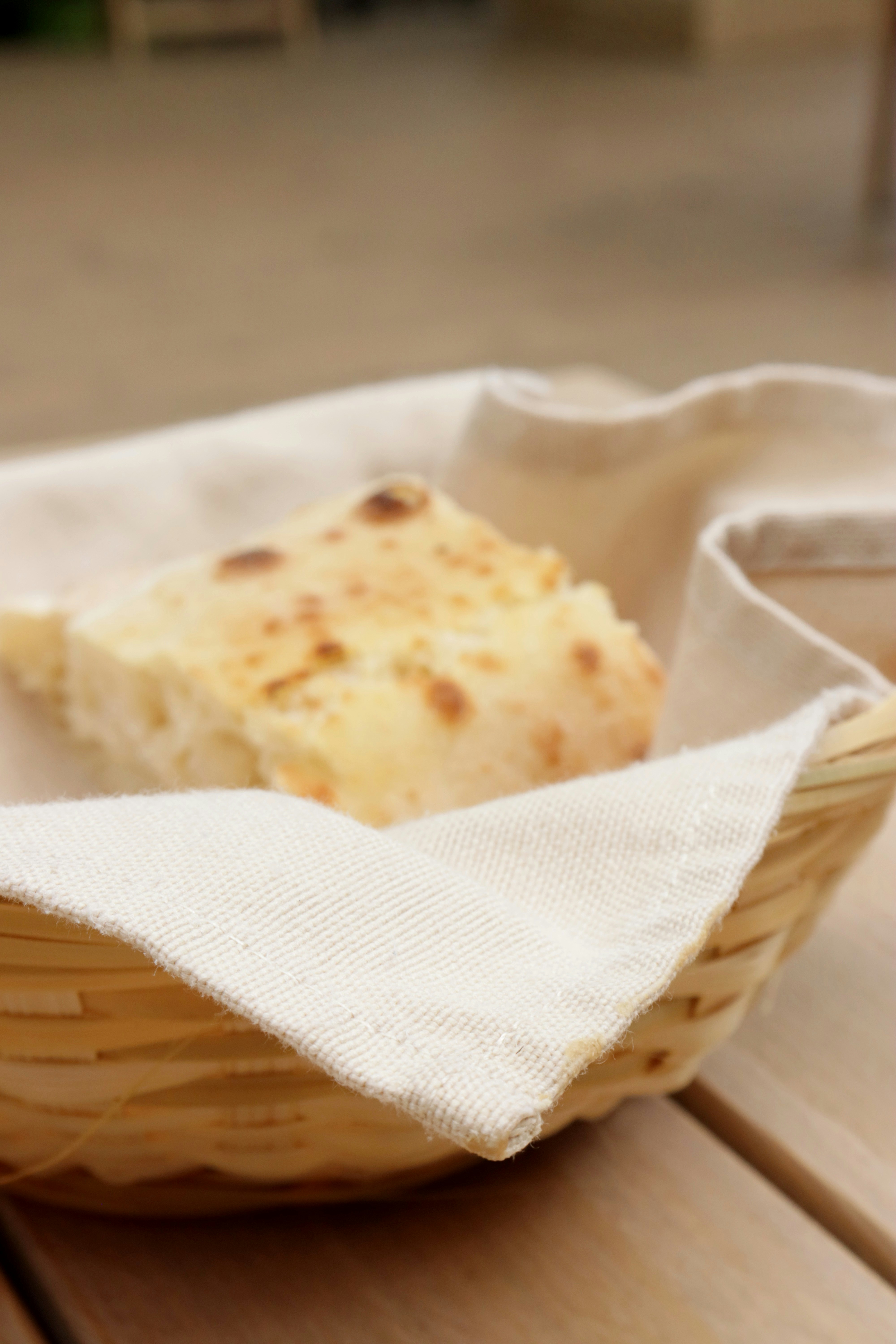 Bread in Basket: Warm Focus on a Rustic Slice