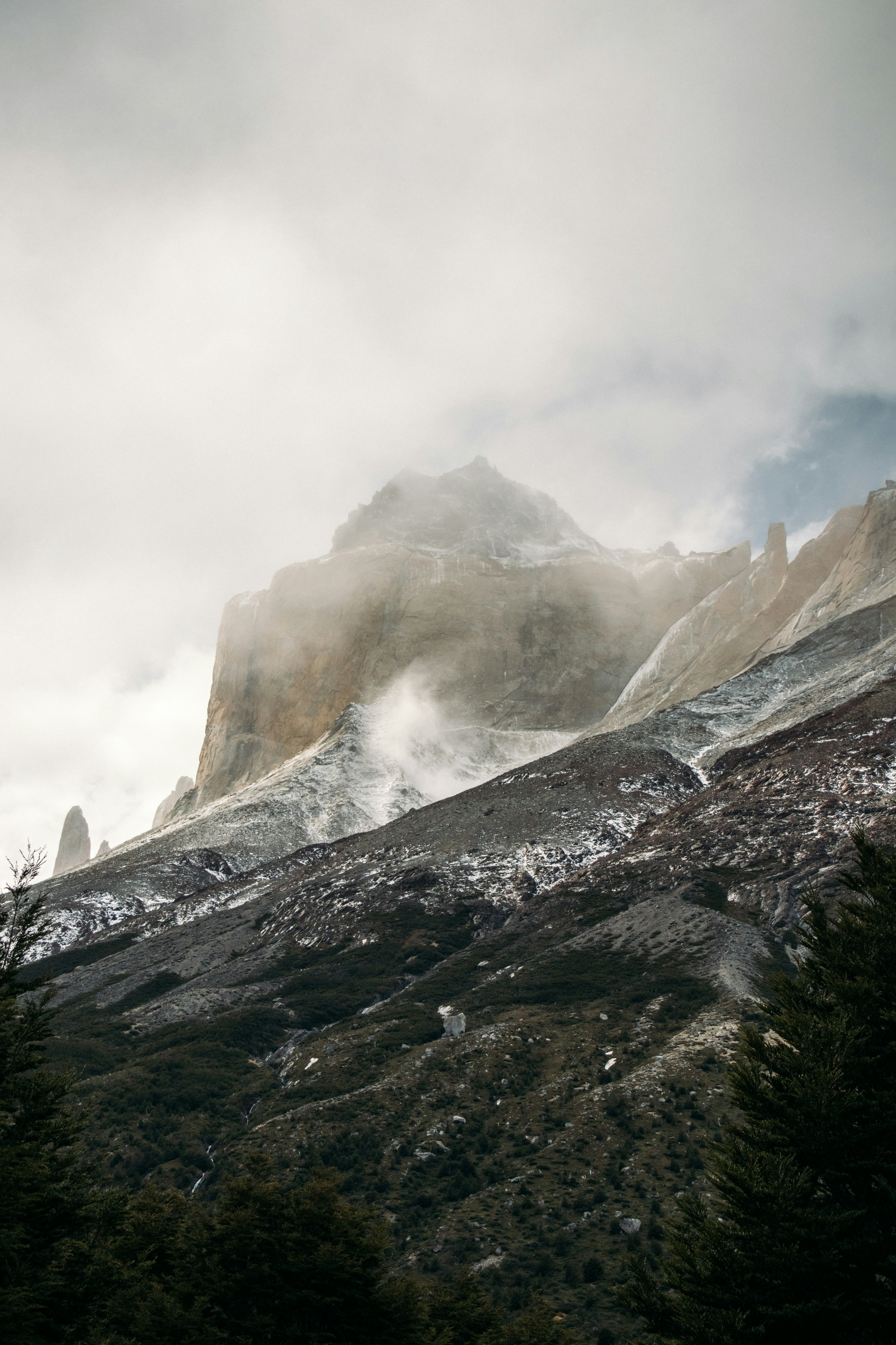 Mist-Ced Mountain Peak Emerging Through Skyward Ridges