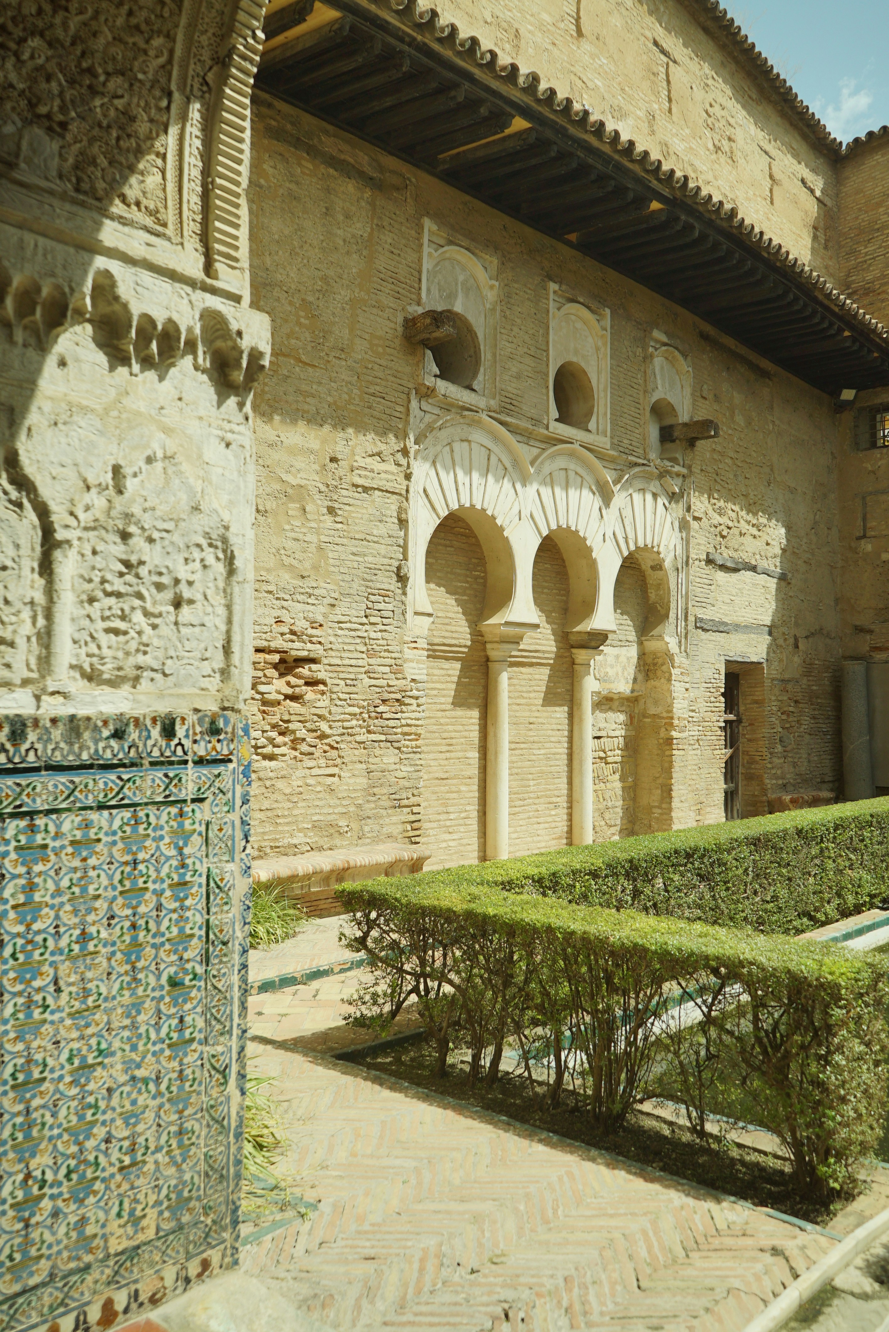 Sunlit arches and tiled courtyard of an ancient fortress