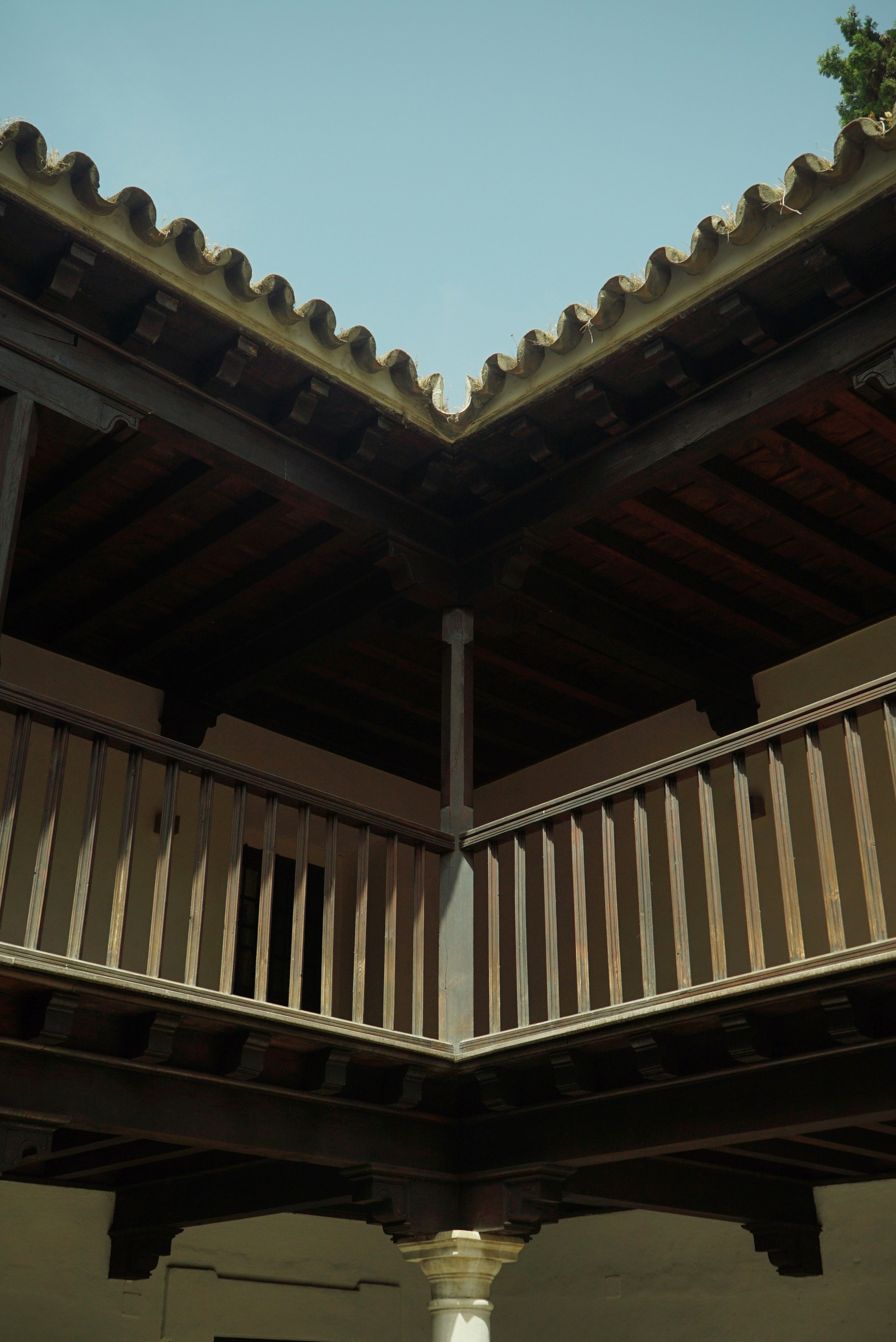 Cornered Courtyard: Echoes of Timber and Tile