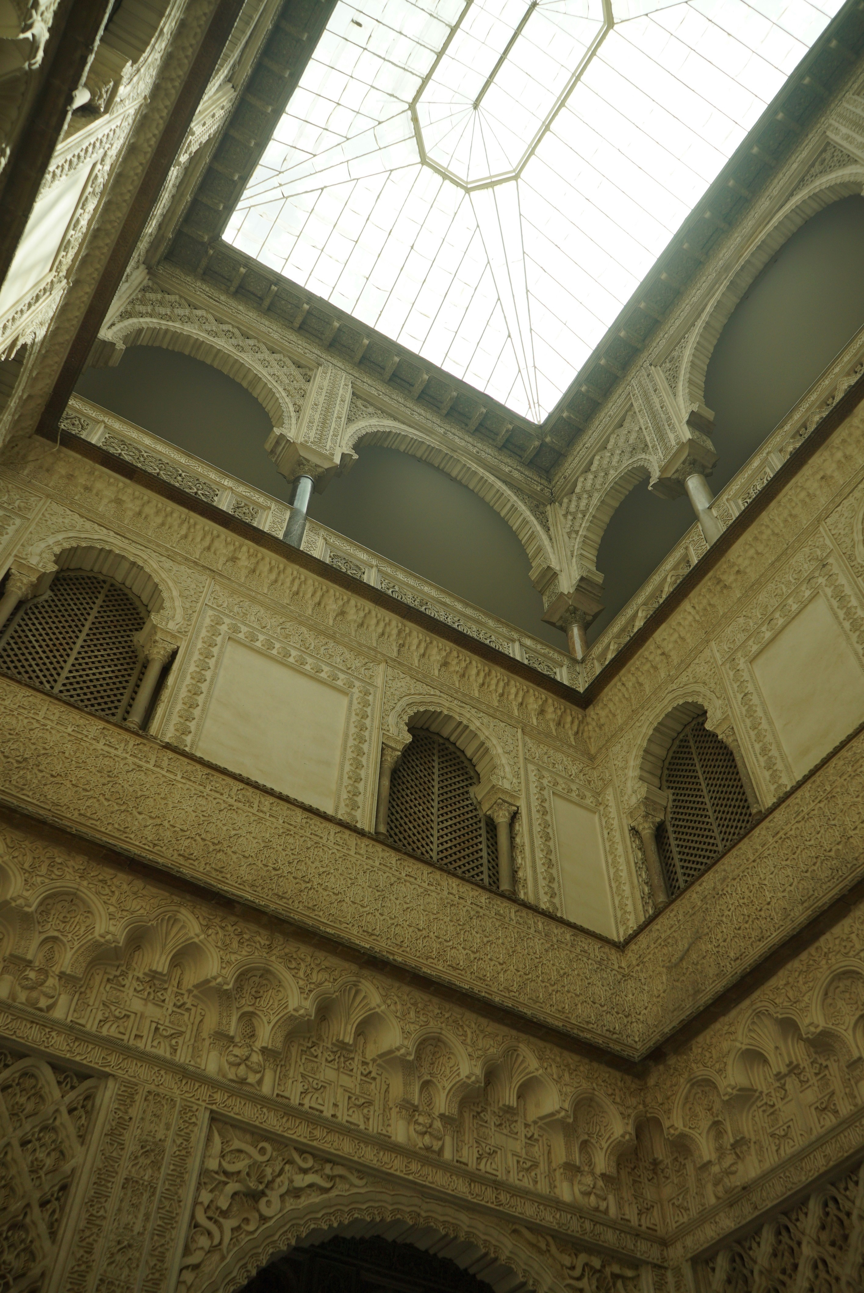 Skylight Cathedral: Ornate Courtyard Vaults Beneath a Glass Ceiling