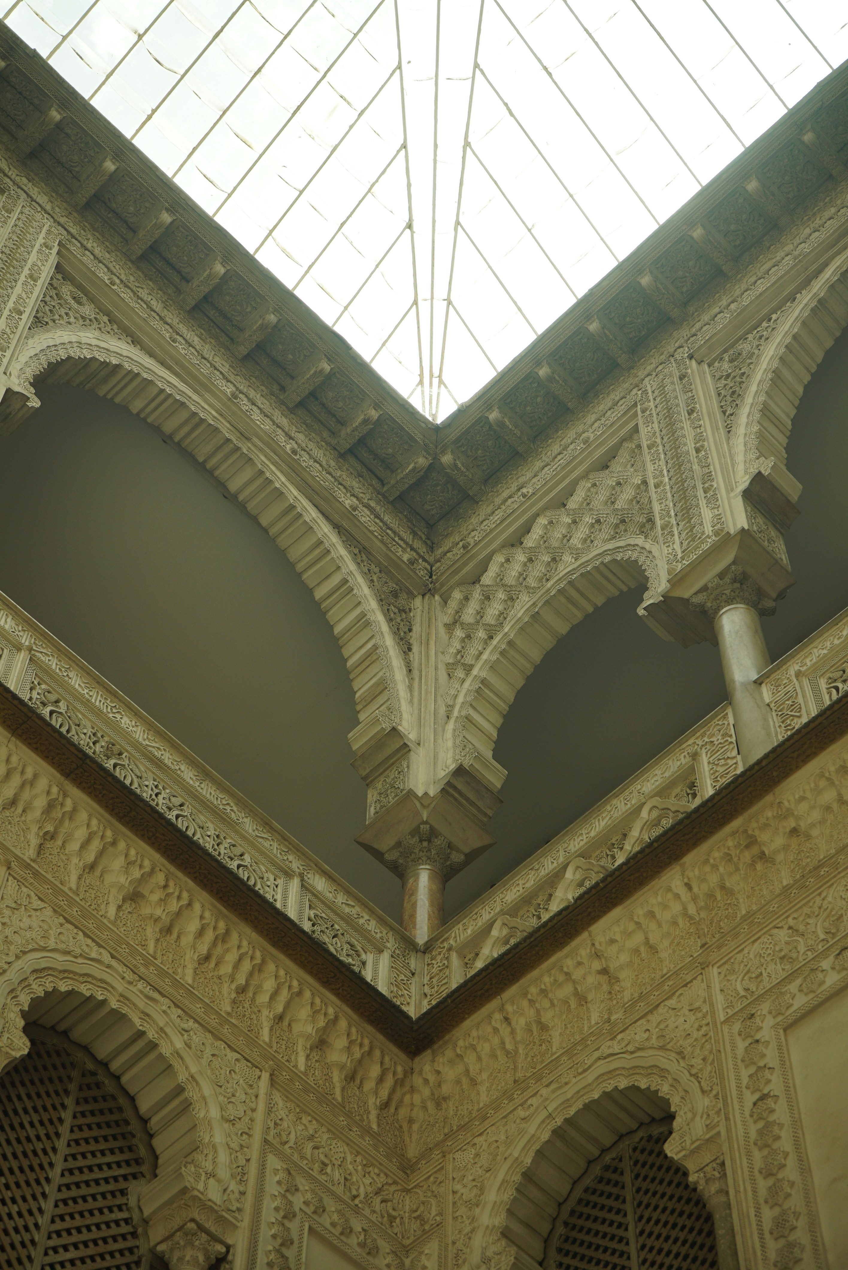 Corner of Ornate Moorish-Crafted Architecture Under Glass Atrium