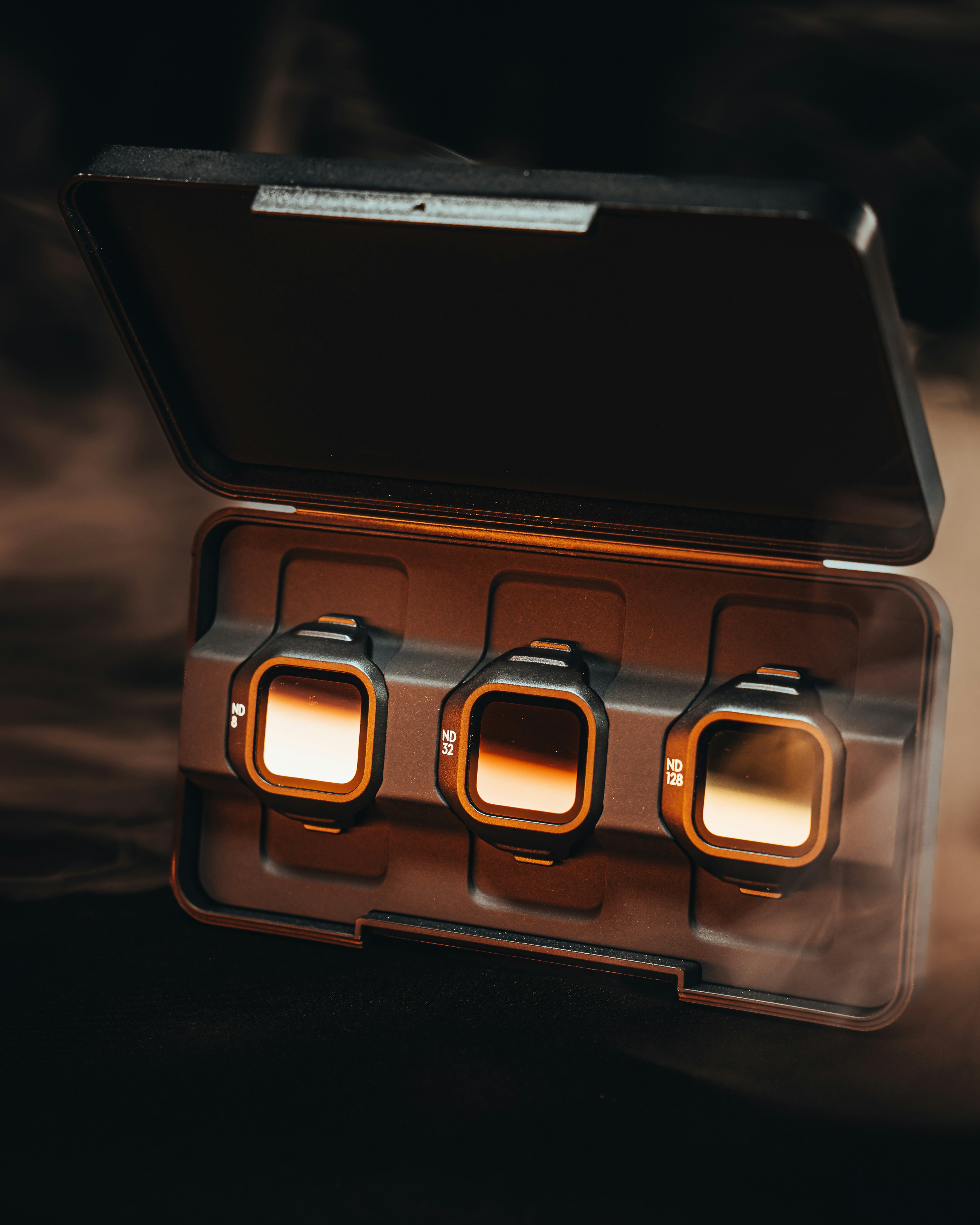 Tri-Case Glides: a row of orange-framed lenses in a protective case
