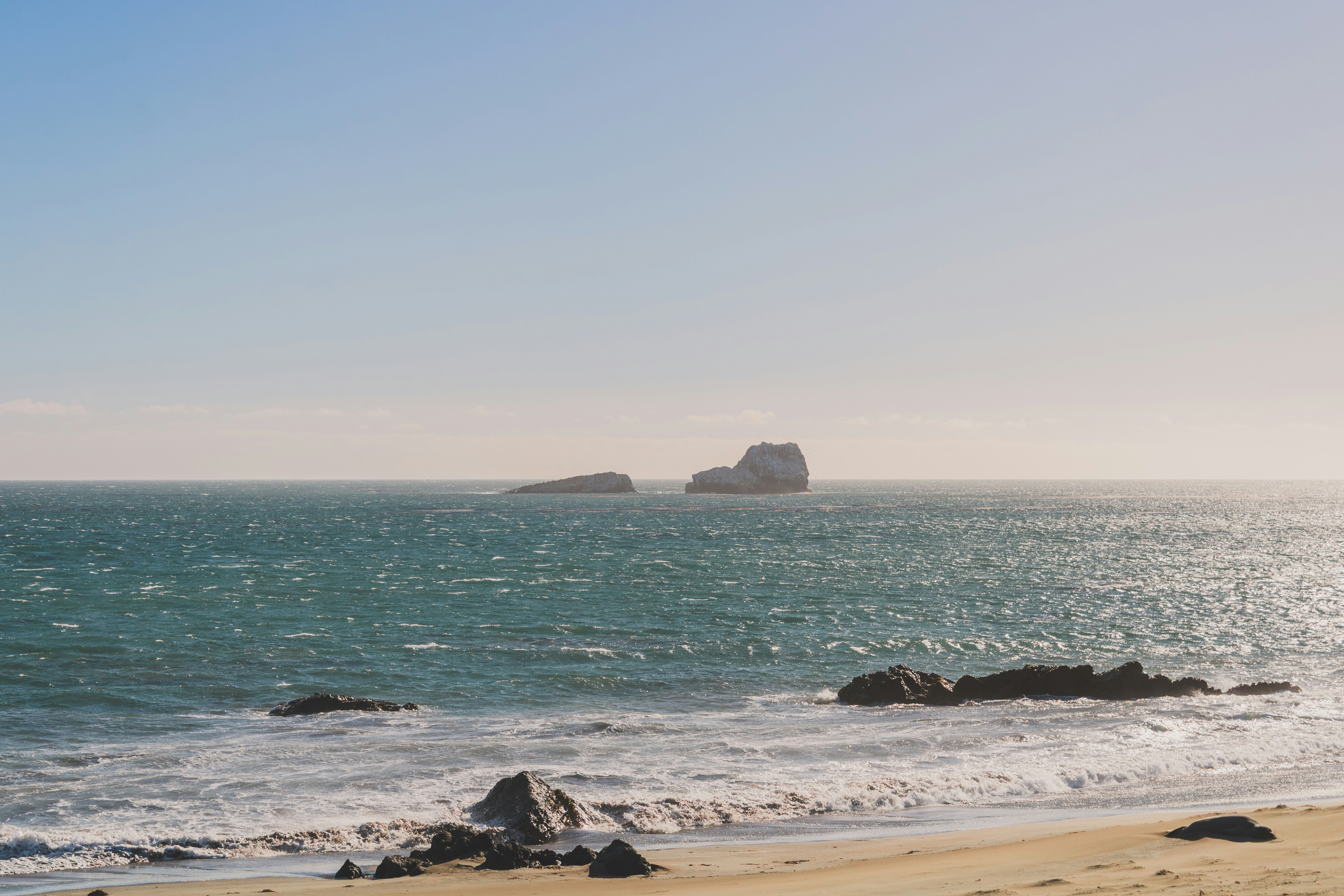 Isolated Sea Stacks on a Calm Horizon