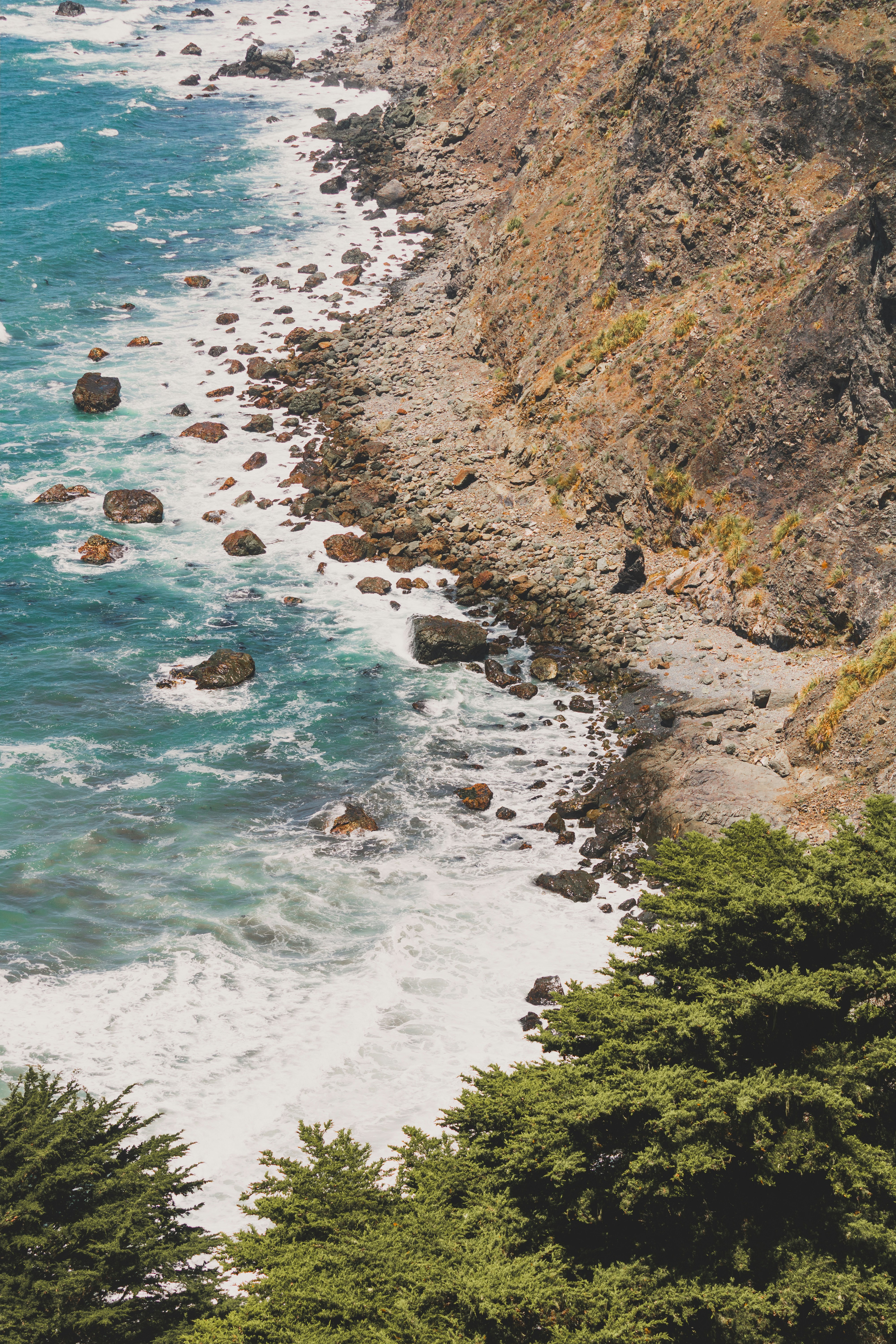 Cliffside Cove: turquoise surf meeting rocky shoreline
