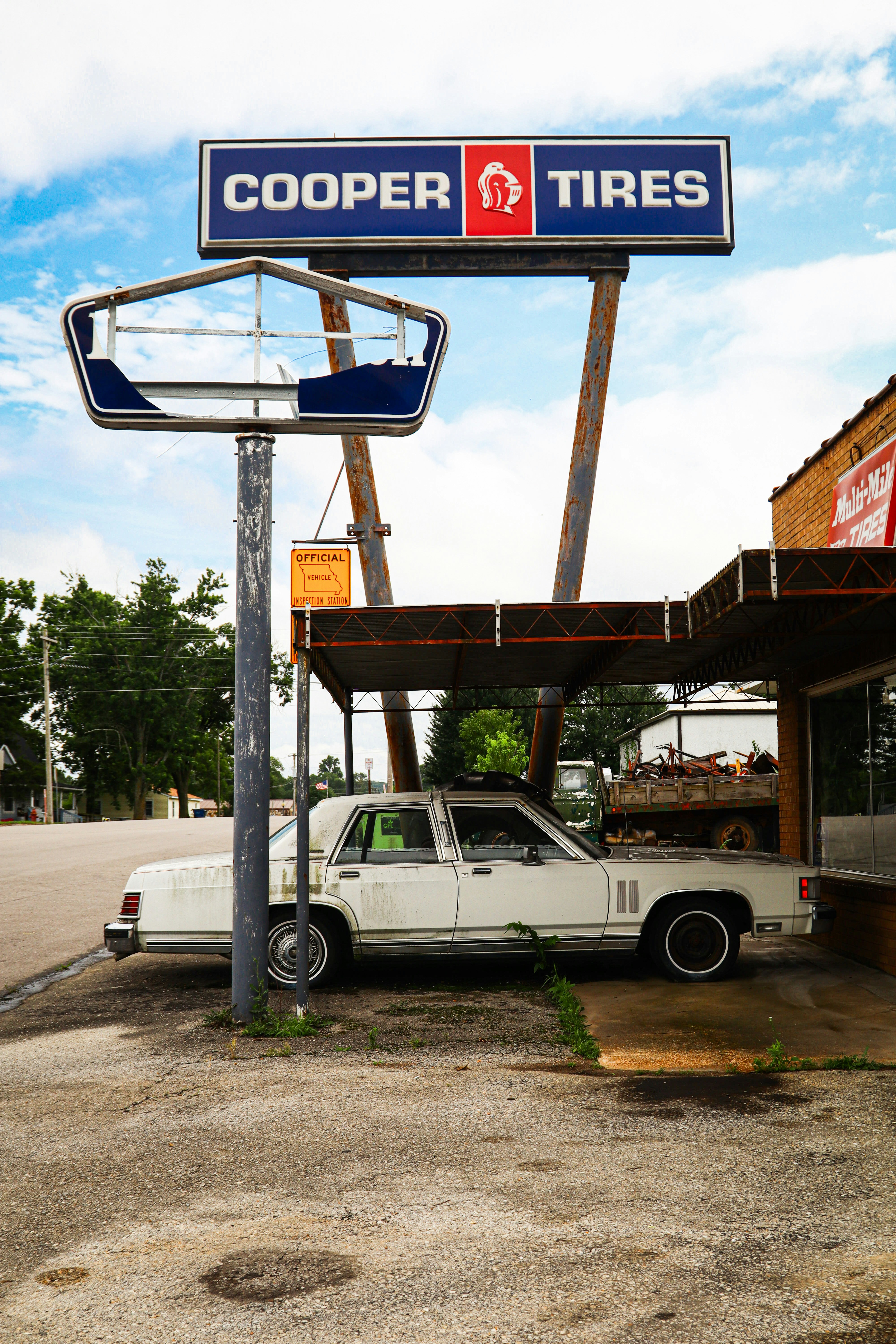 Old-School Tire Shopby the Roadside Sign