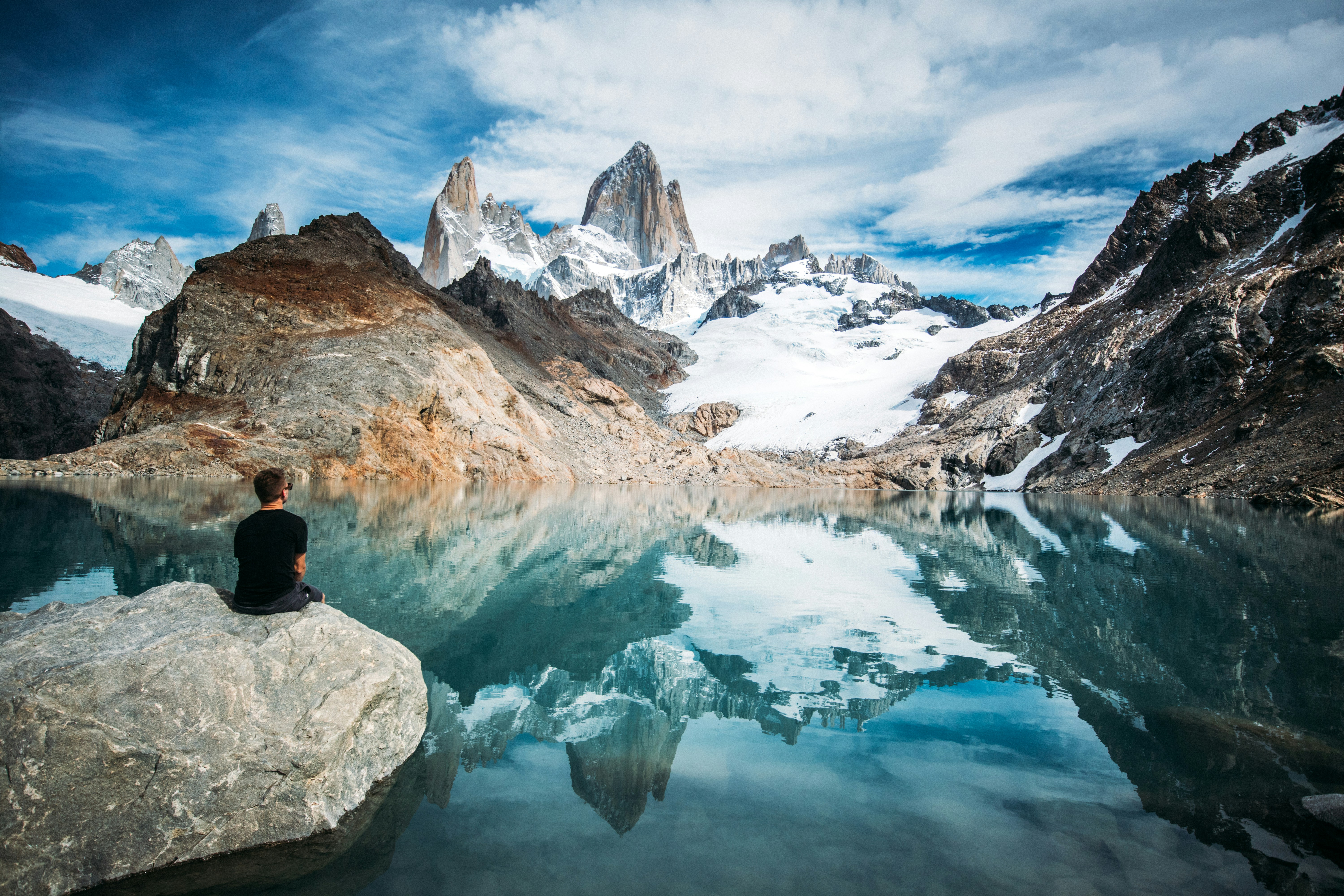 Horizon of Ice: A Lone Seeker Before Panoramic Peaks