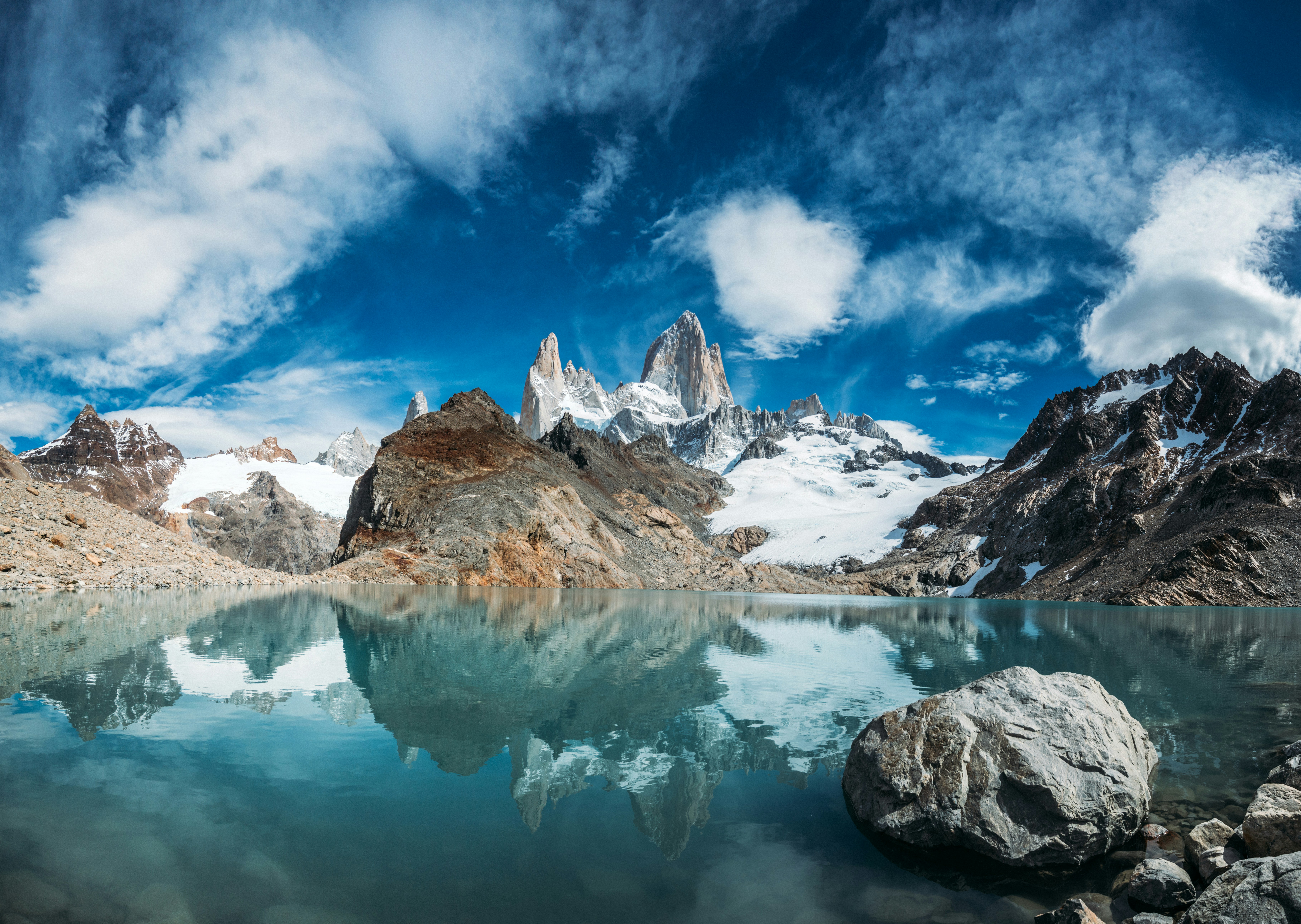 Mirror Peak: Snow-Capped Prominence over a Tranquil Alpine Lake
