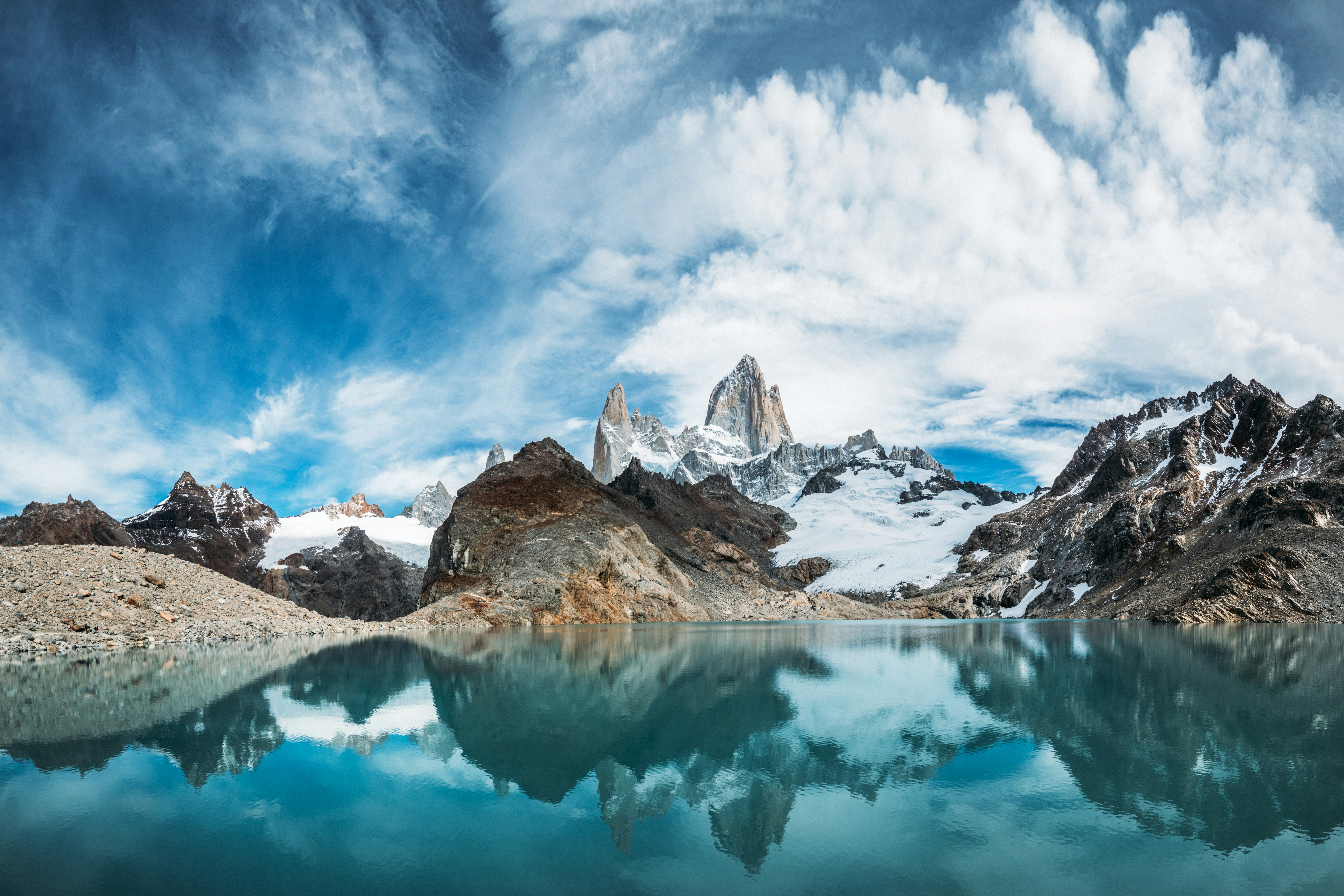 Glacial Crown: Peaks, Cloudscape, and a Still Mirror