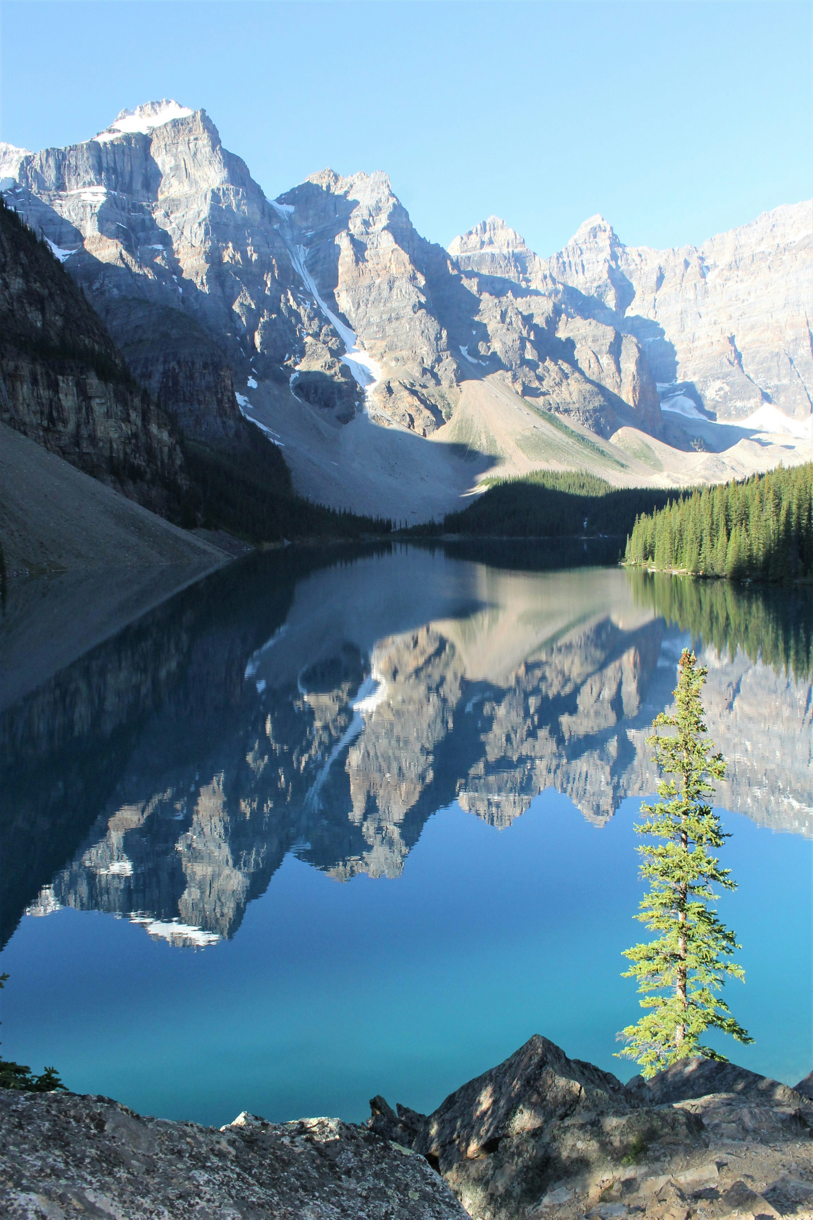 Mirror of the Peaks: Alpine Lake and Snowy Range in Clear Light