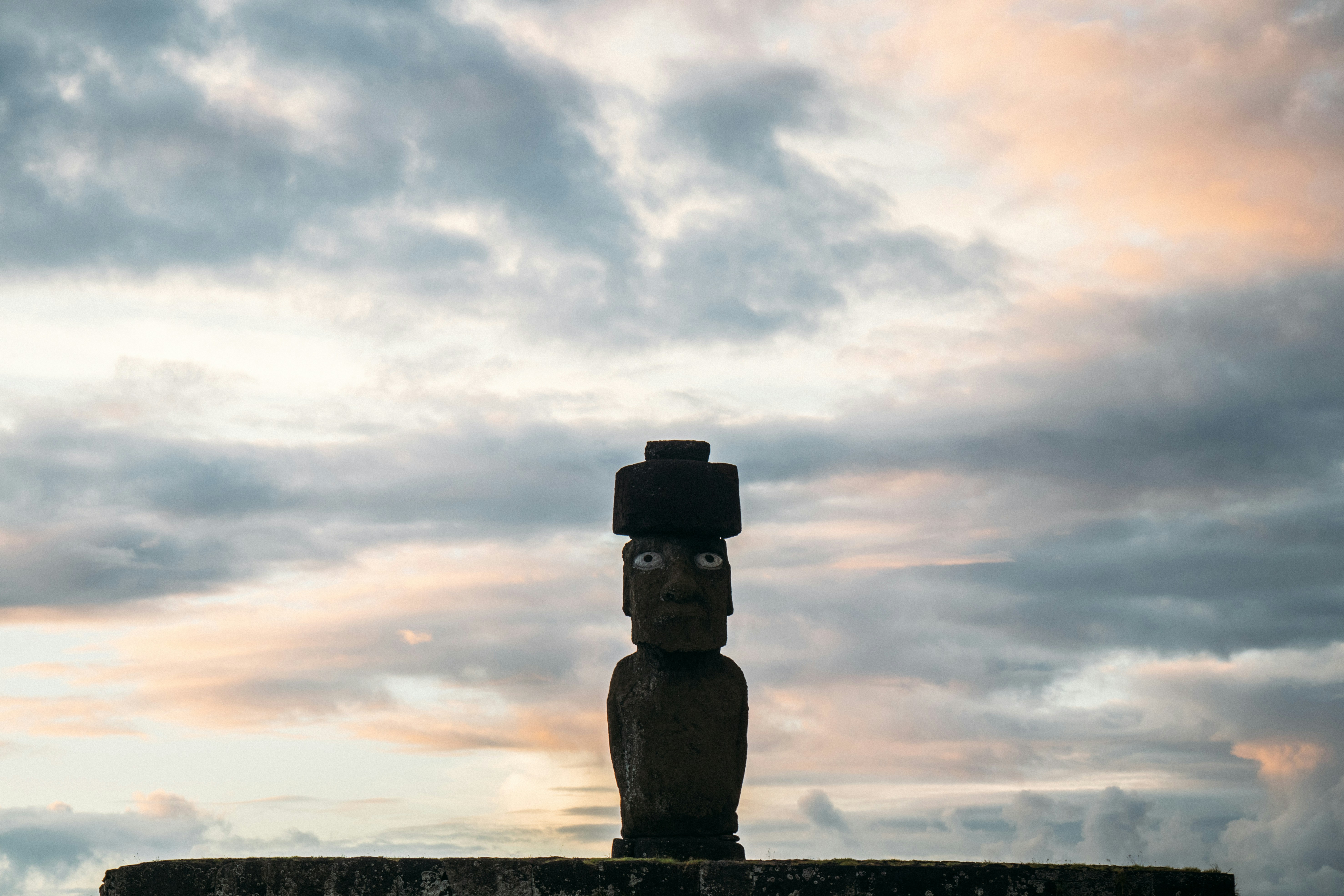 Solitary totem against a dusk-lit horizon