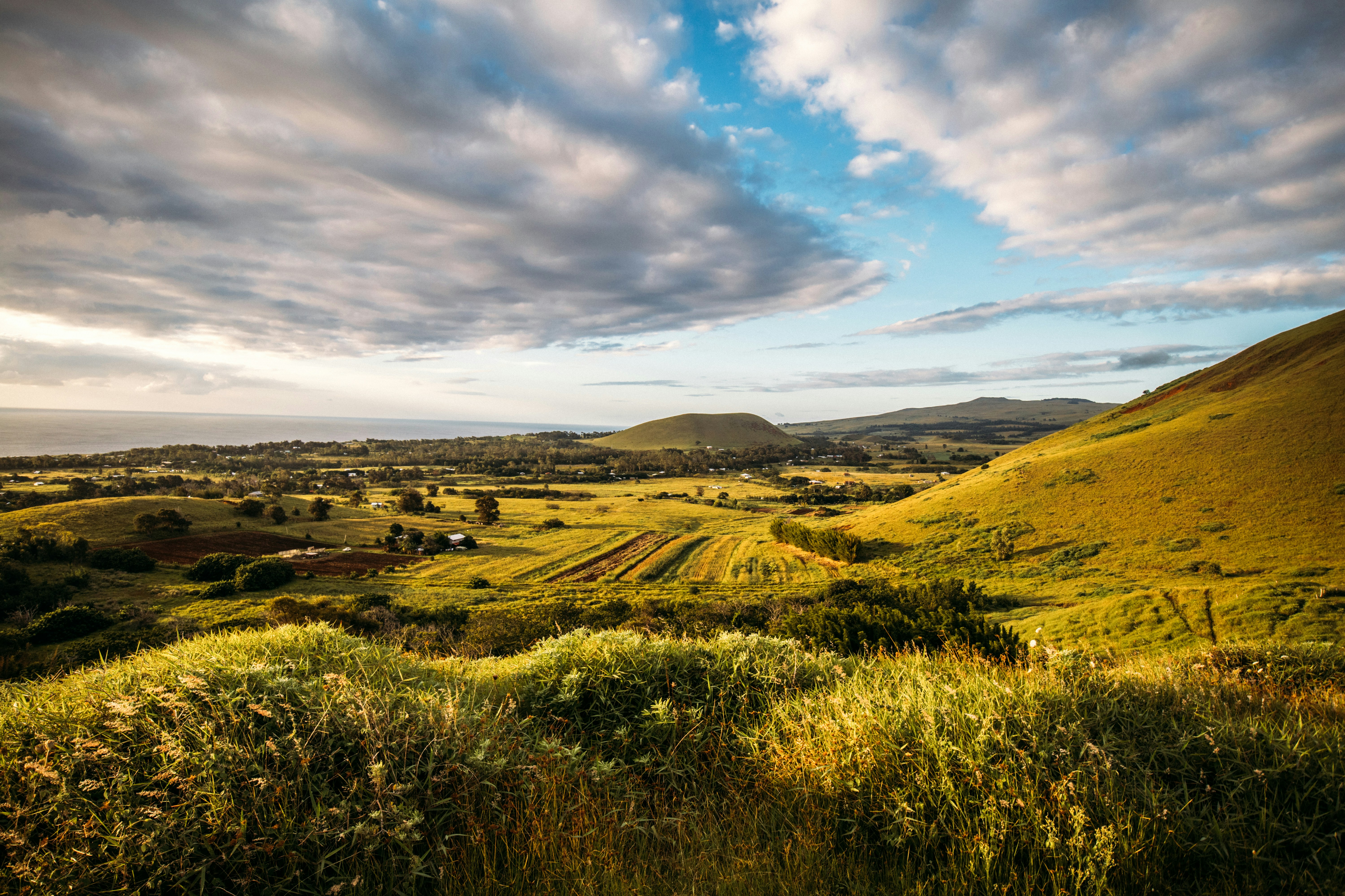 Golden Valleys Under Expansive Sky