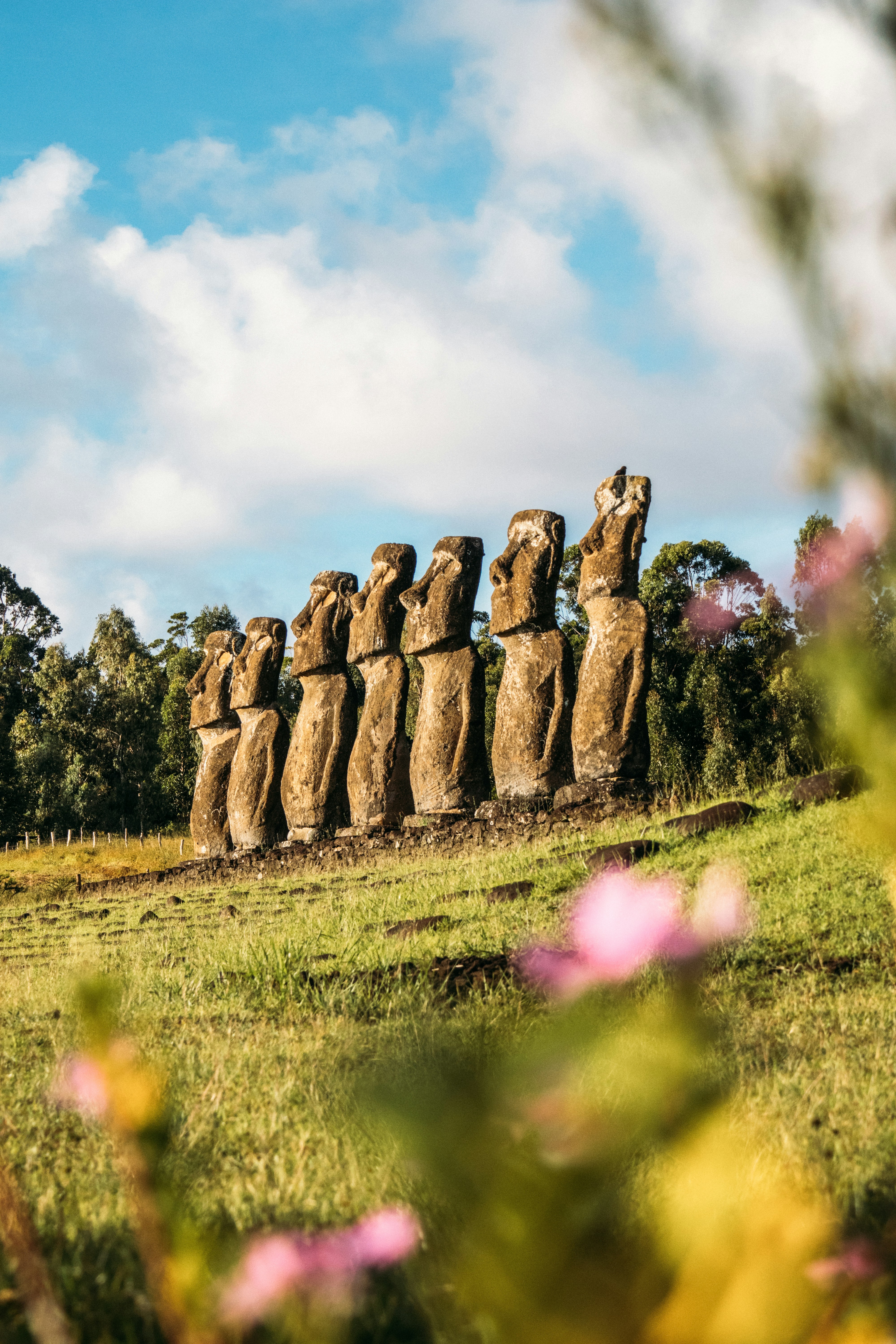 Stone Guardians on a Gentle Slope under a Bright Sky