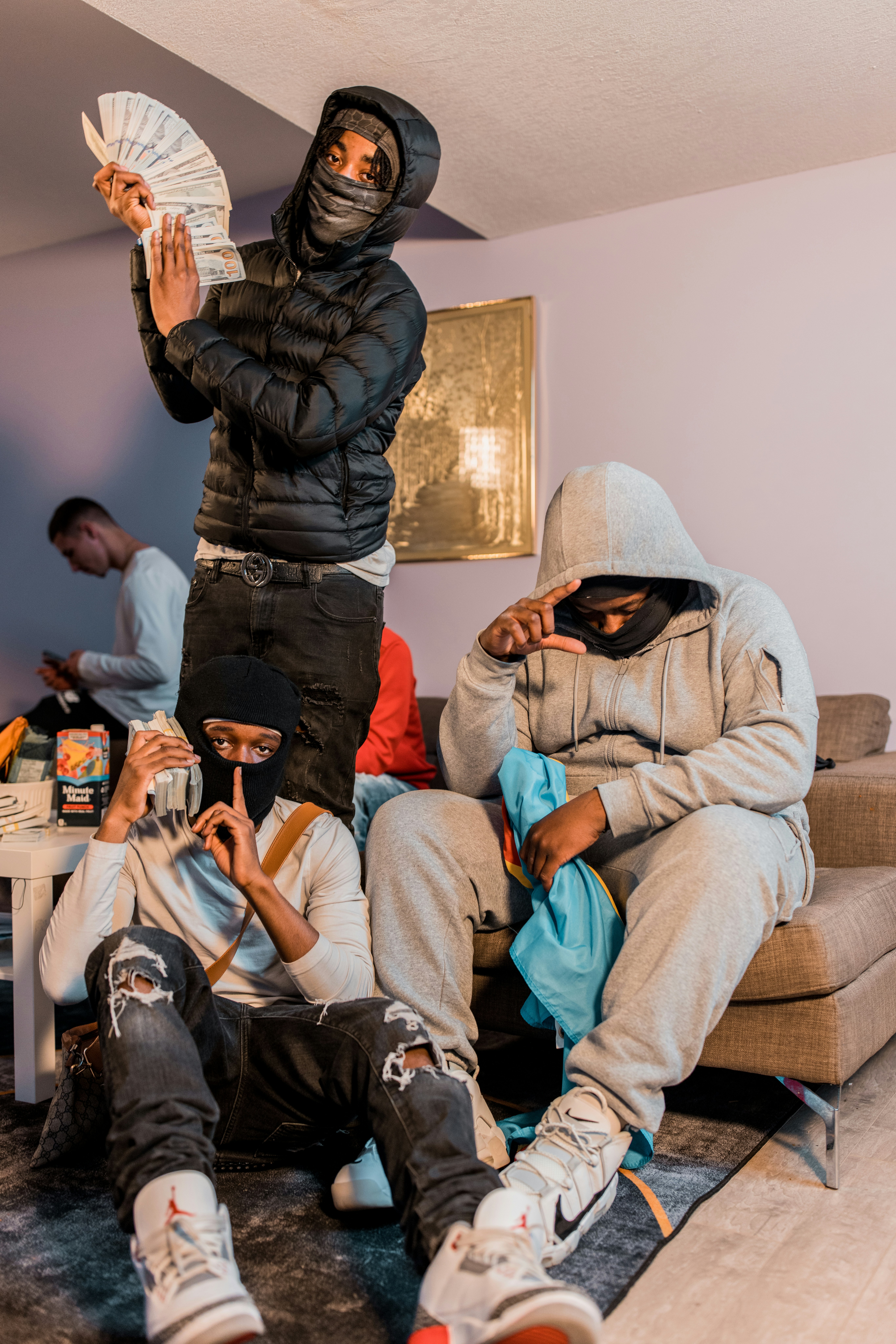 High-Stakes Props: Stacked Cash and Hooded Prowess in a Quiet Room