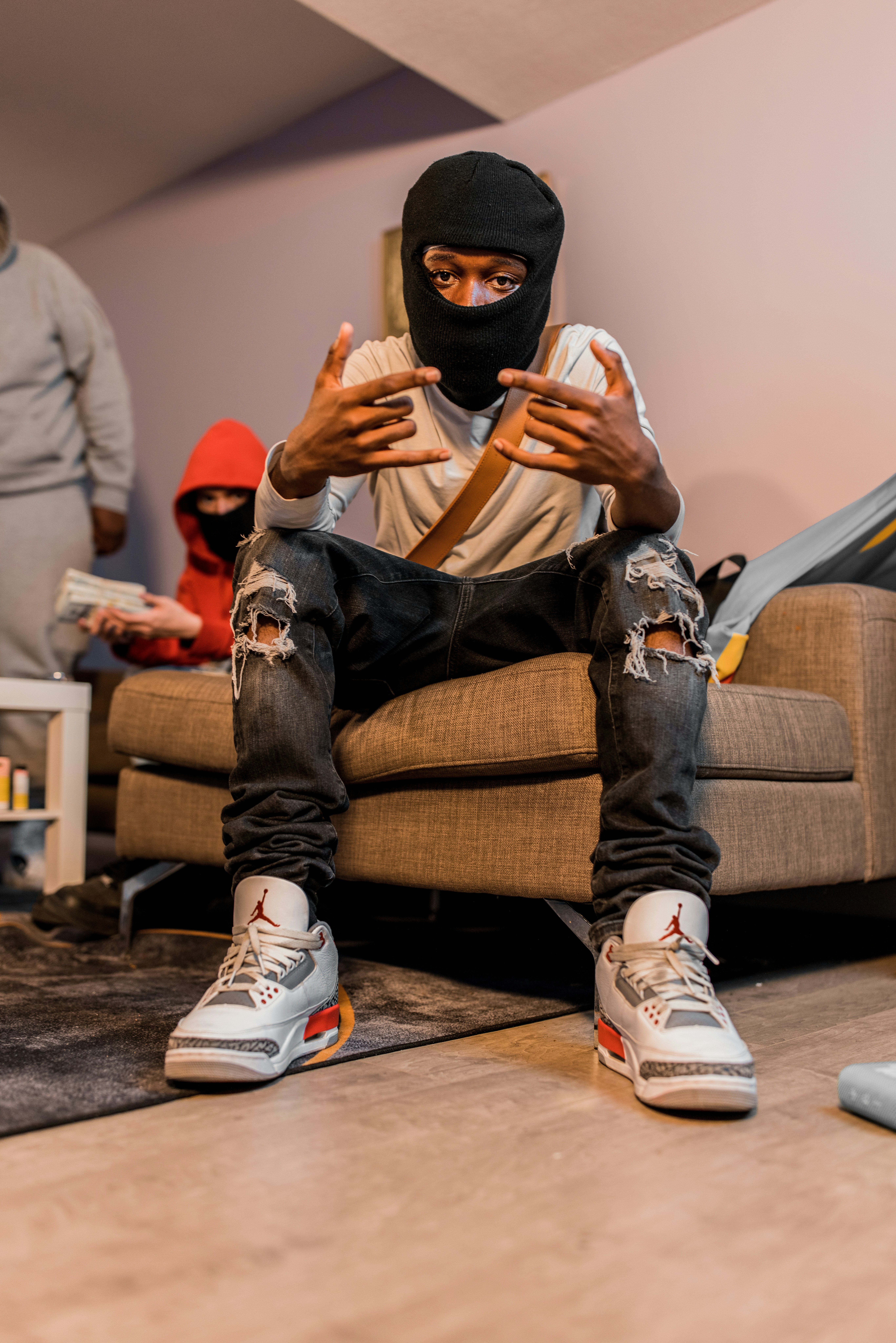 Masked Gangsta in a Cozy Living Room: A Portrait of Confidence