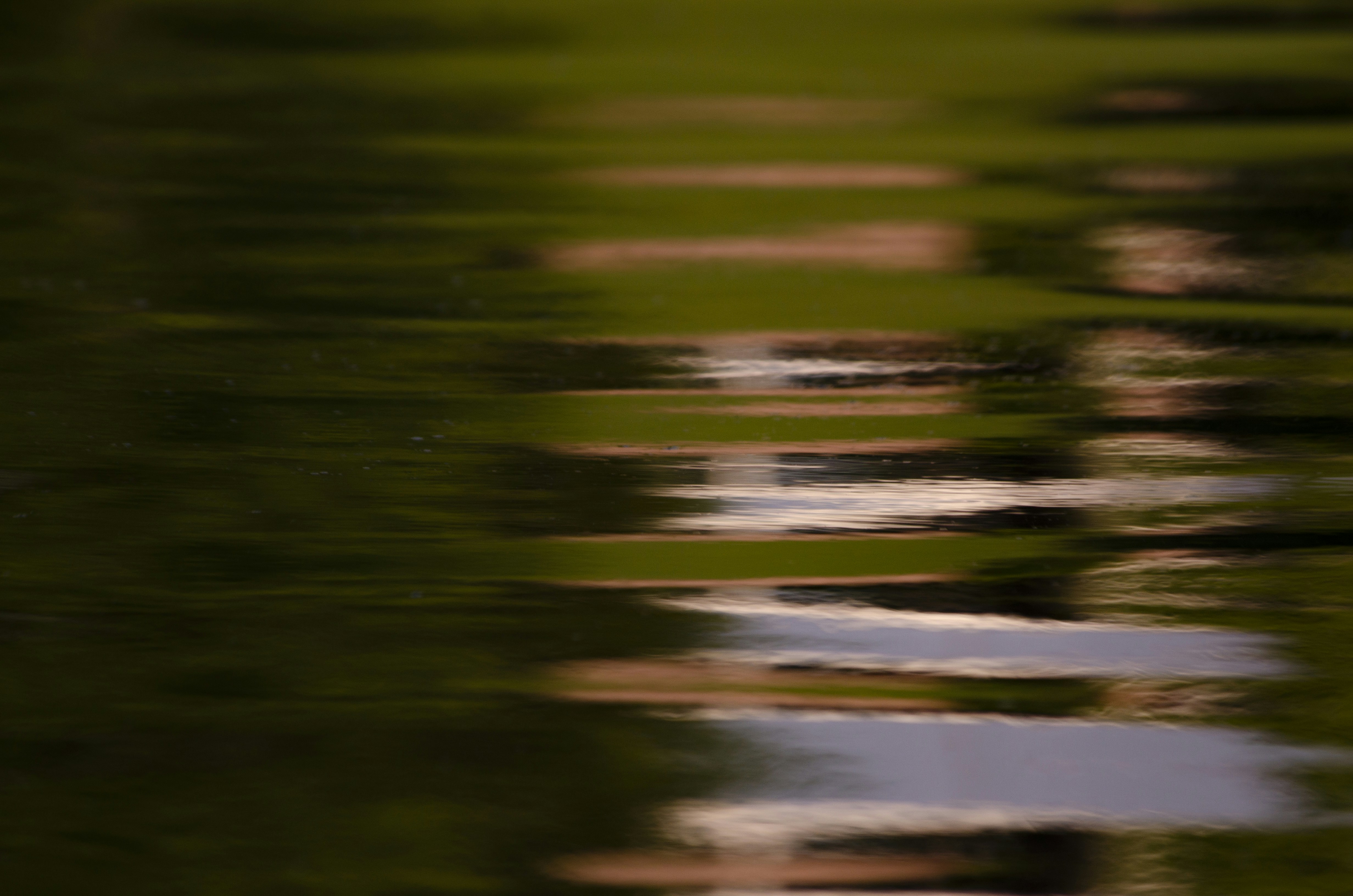 Rippling reflections: a distorted still-life of a lakeside scene