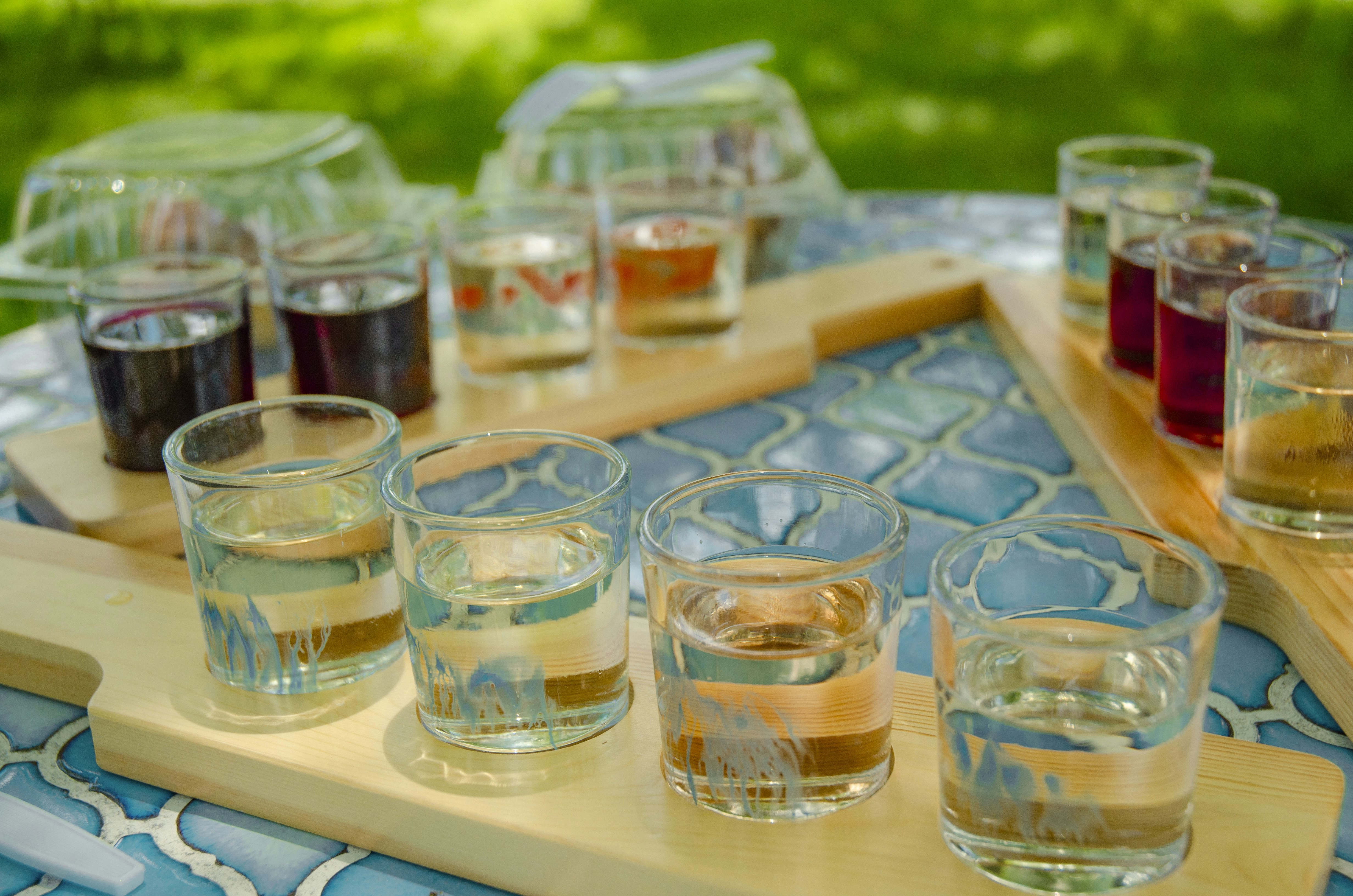 Glass Flight: Colorful Shots on a Wooden Tray
