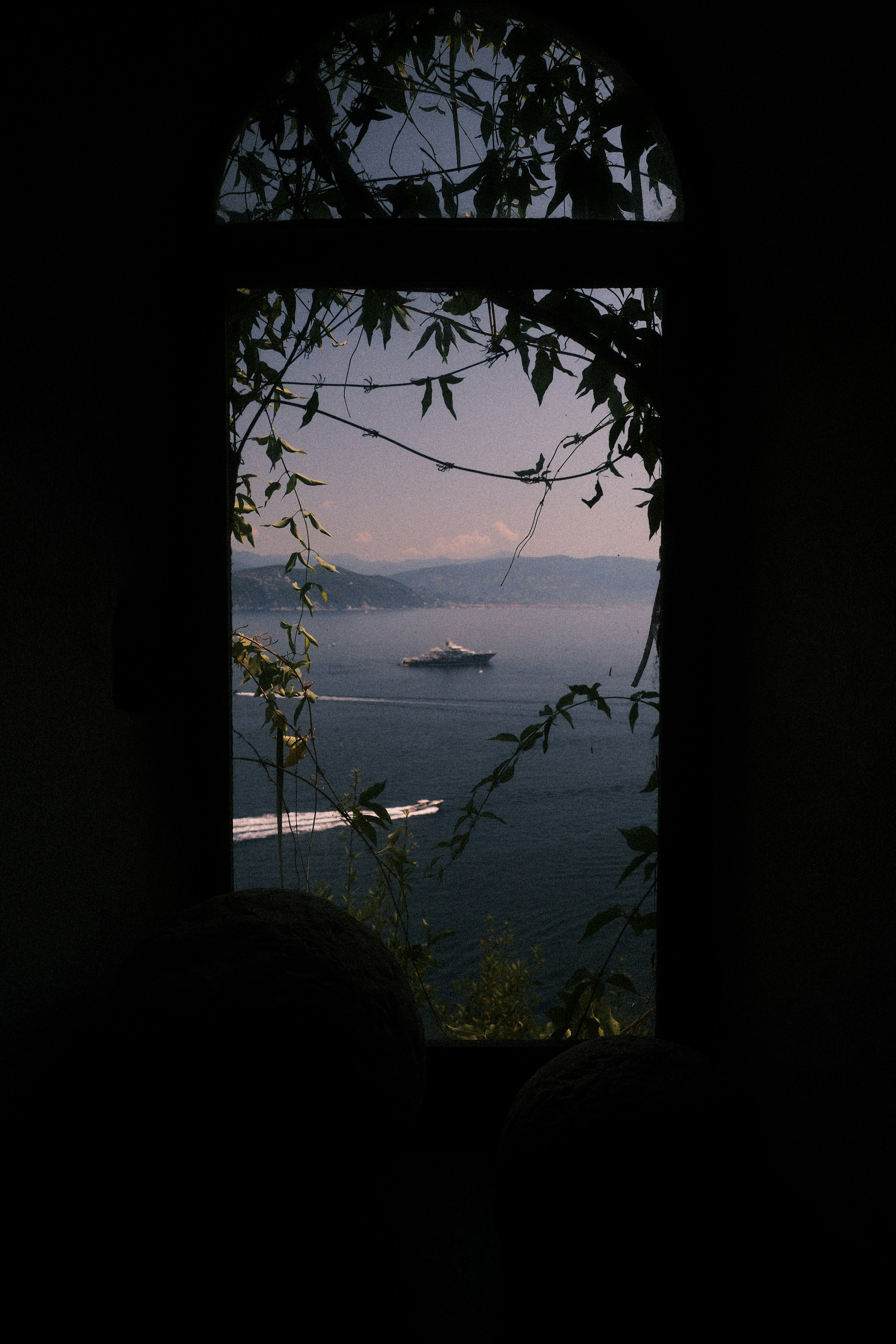 Sea Gate: A Boat Near the Windowed Vines