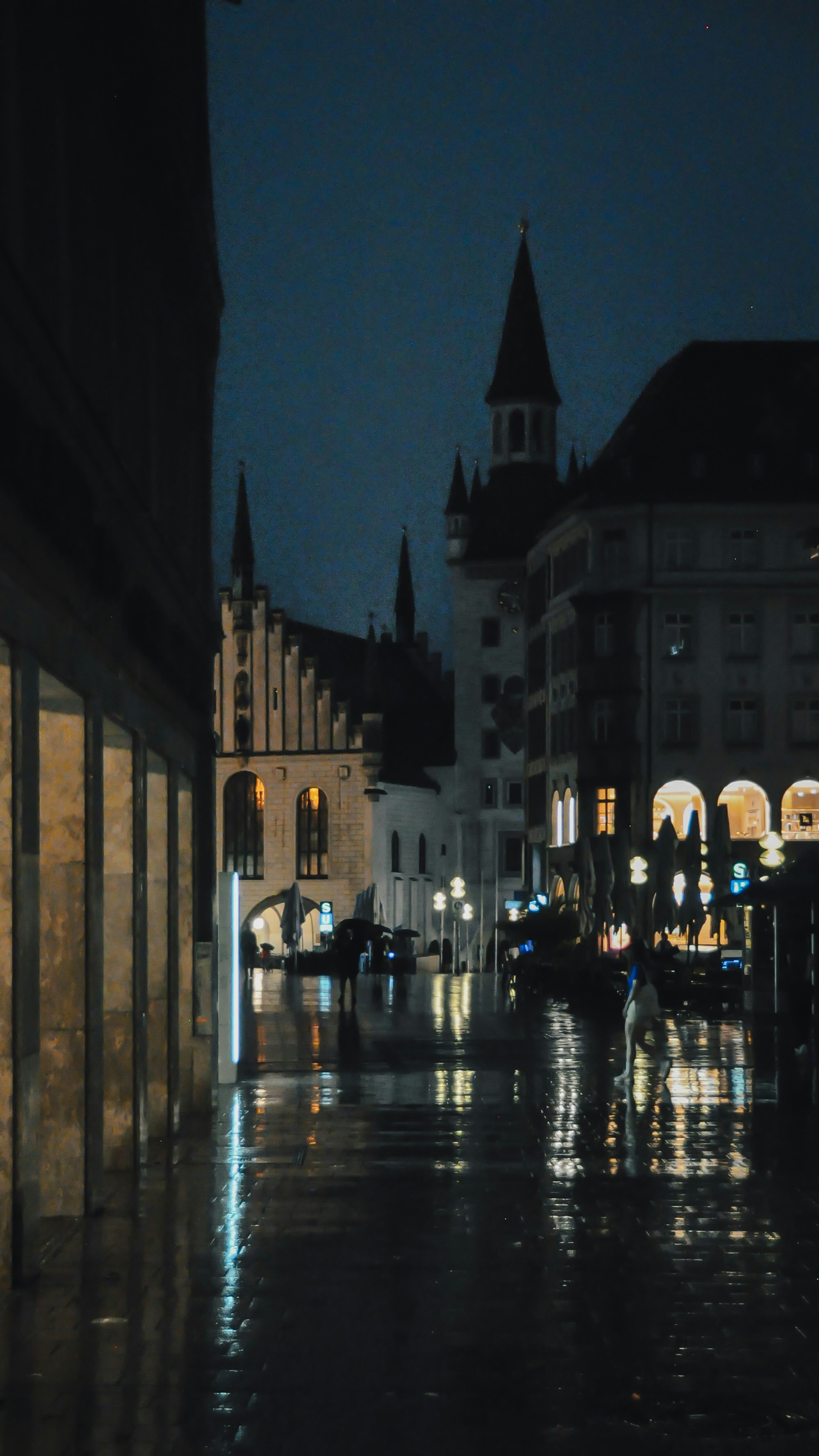 Moonlit Piazza: Reflections on a Rain-Slick Night