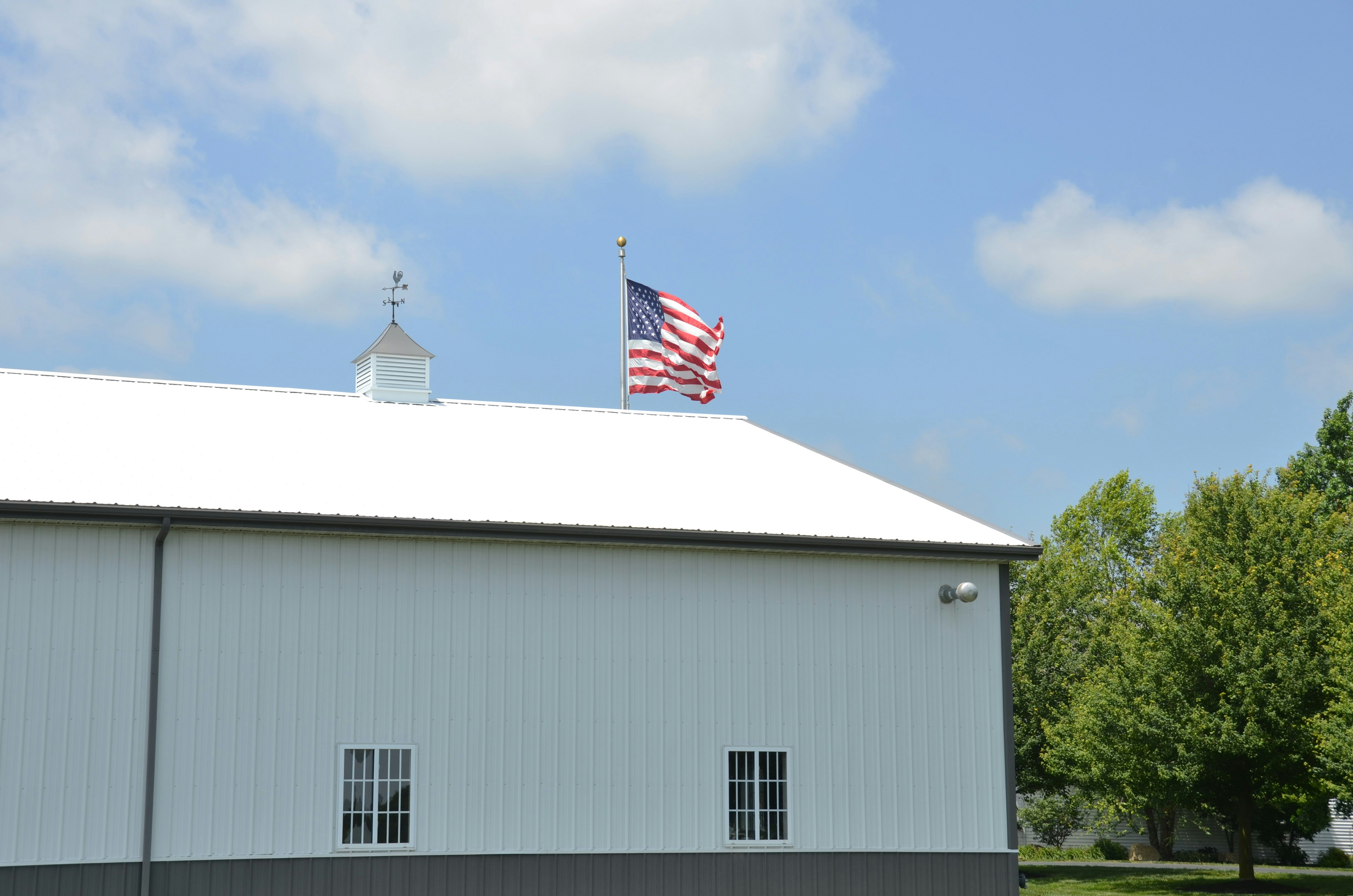 Flag Over White Barn: A Quiet Country Moment