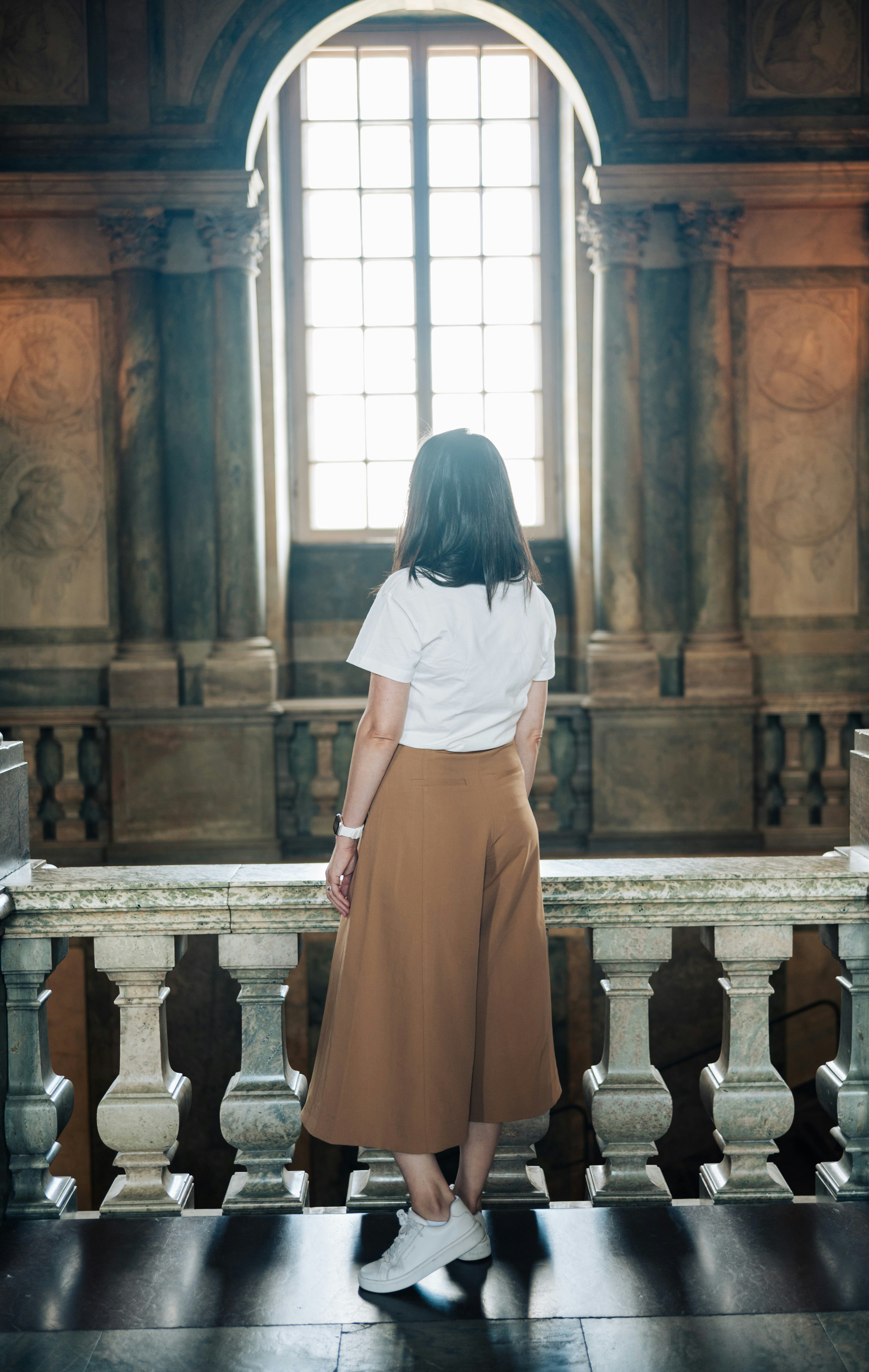 In the Grand Archway: Portrait of Quiet Curiosity