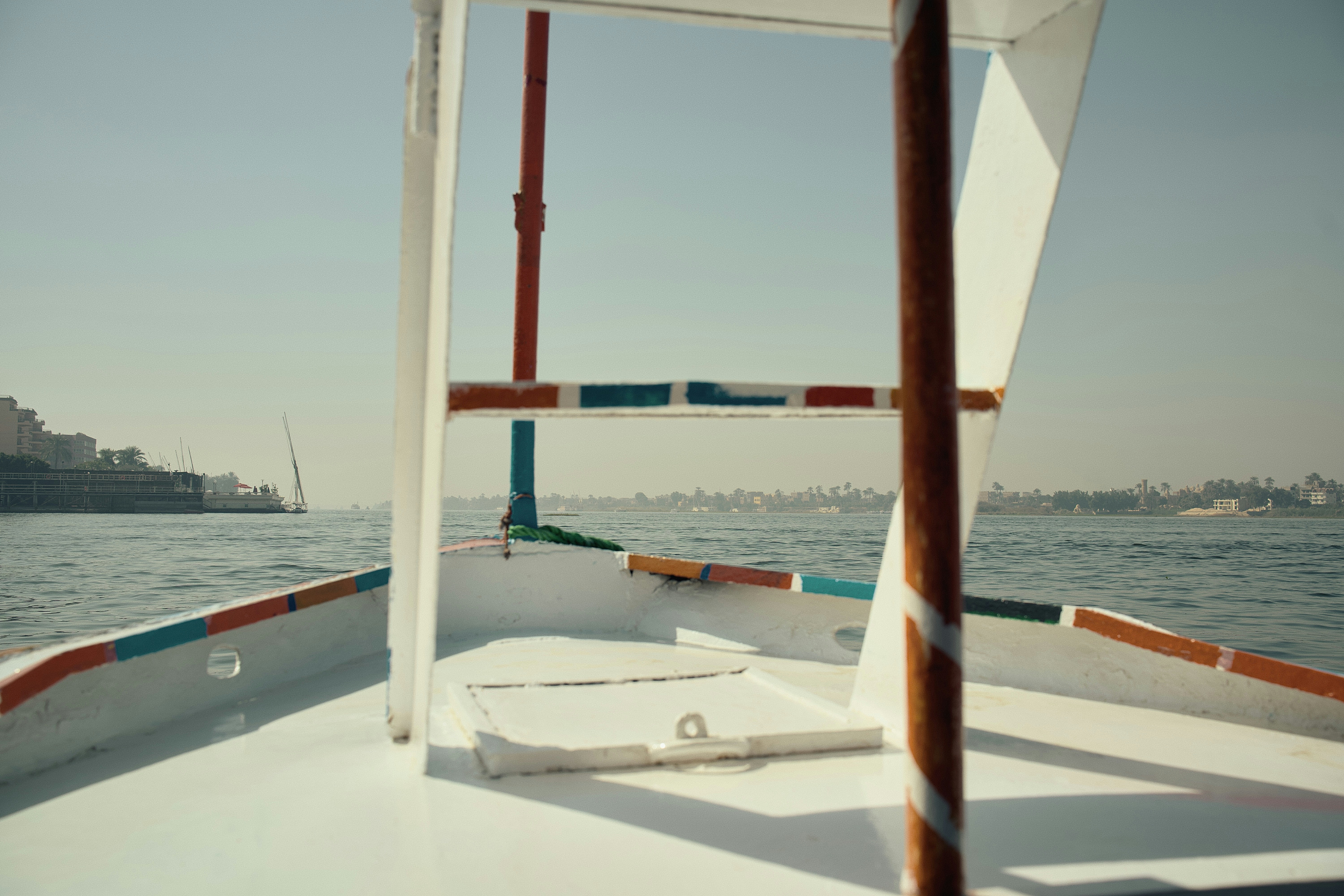 Crimson Rails Over Calm Waters: A First-Ploat View from the Bow