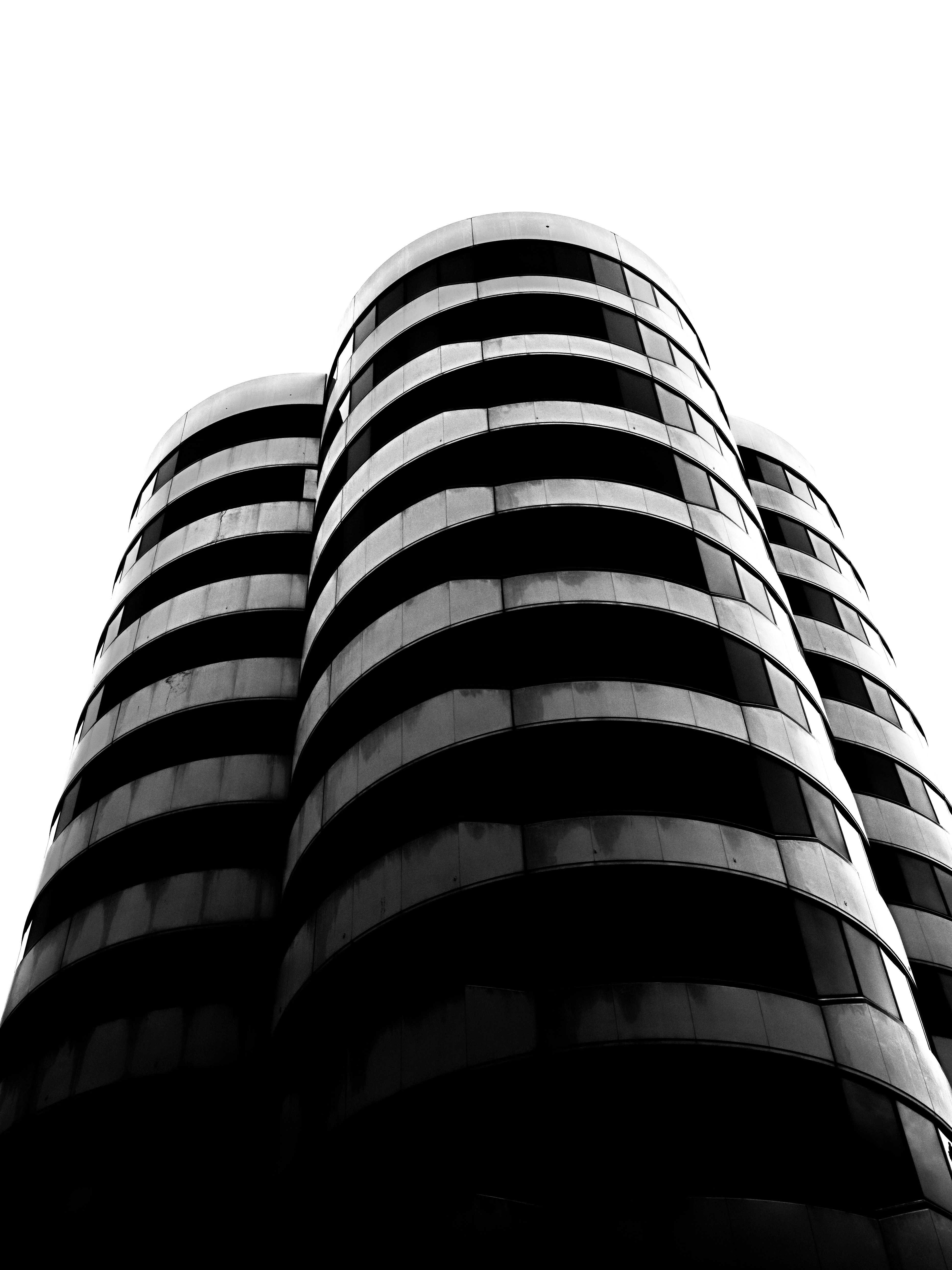 Stacks of Shadow: A Cylindrical Facade Reaching Toward the Sky