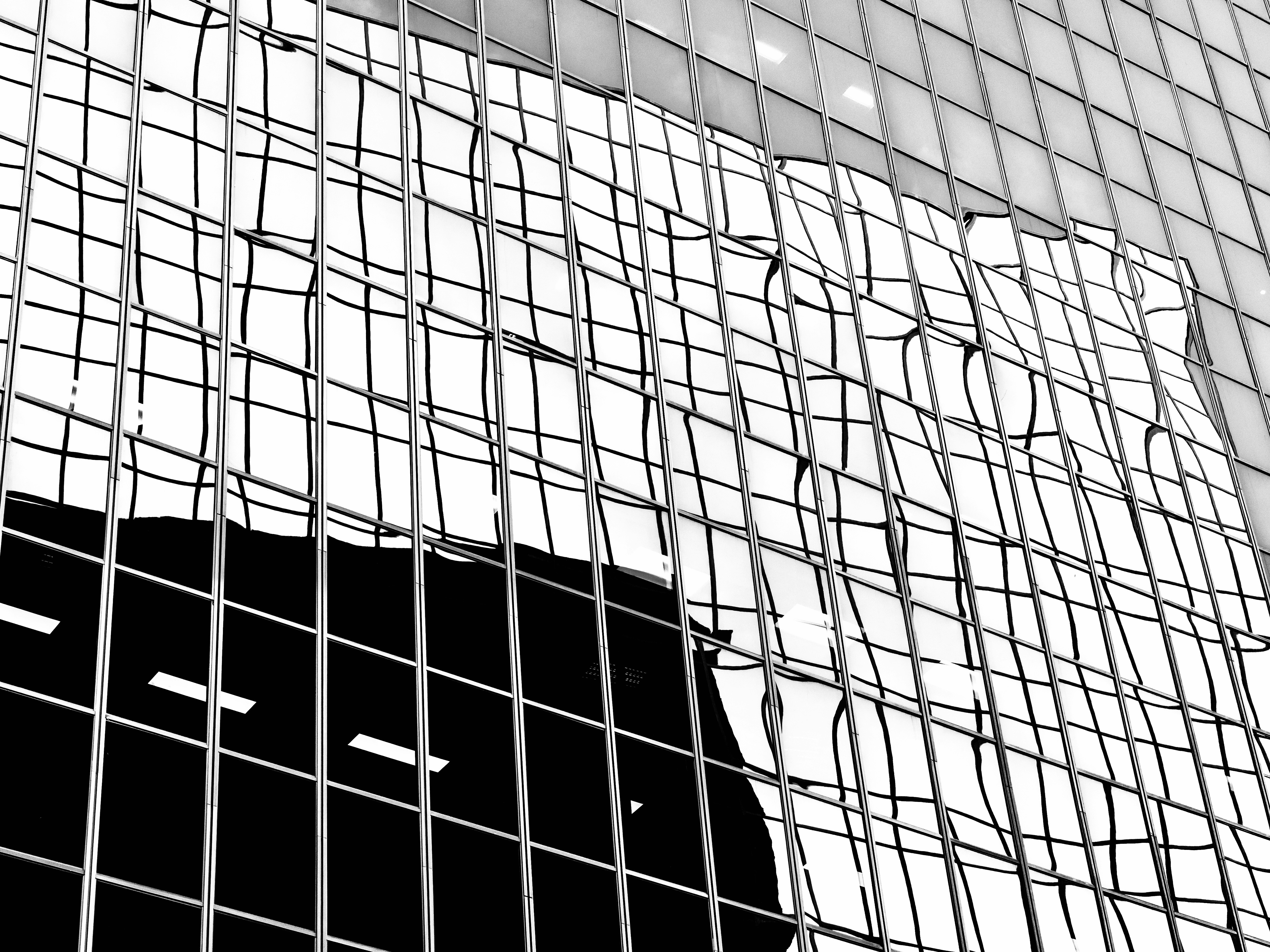 Crosshatch Echo: Facade Mesh Over a Shadowed Reveal
