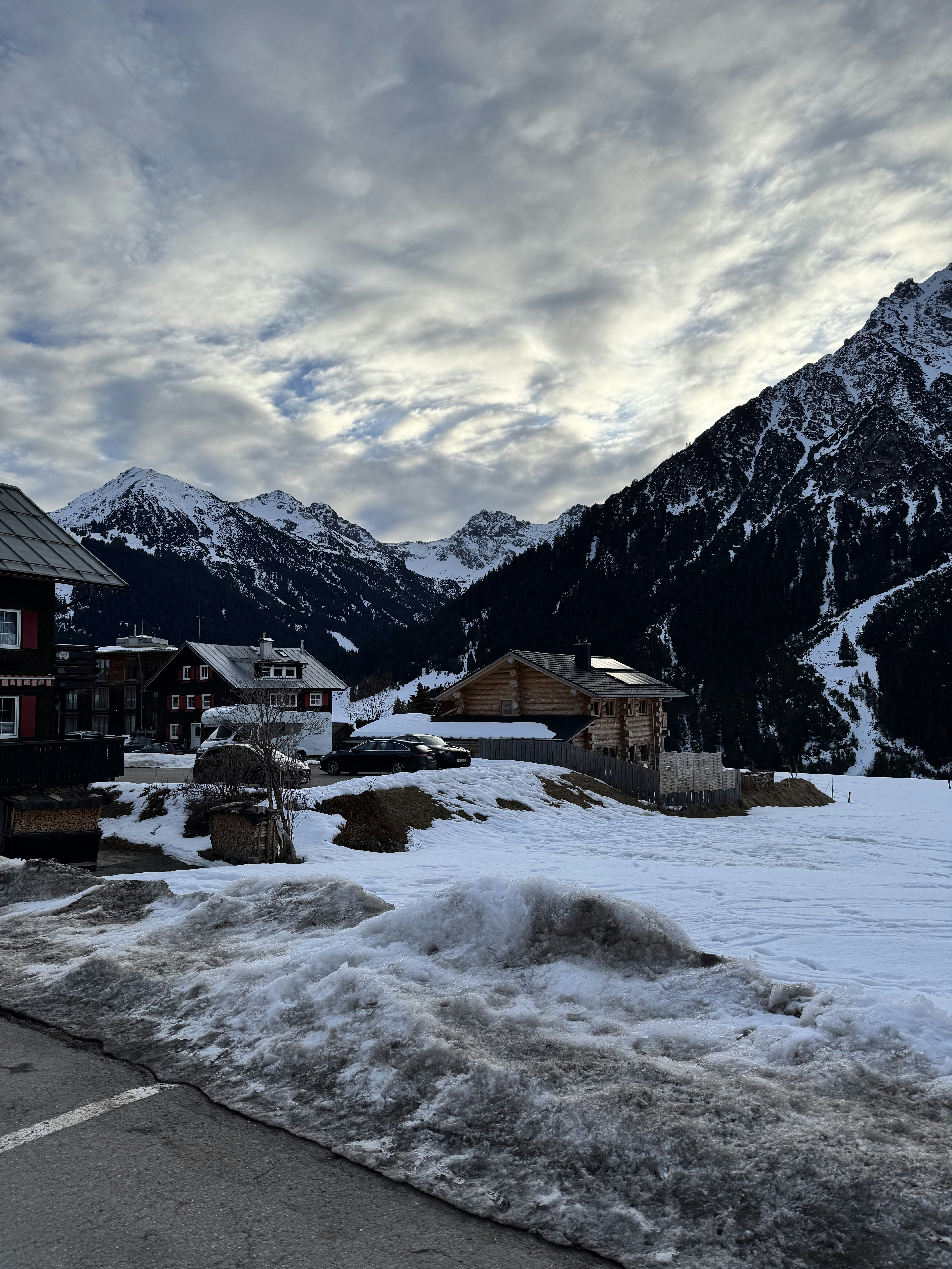 Snowy Alpine Village at the Foot of Sharp Peaks