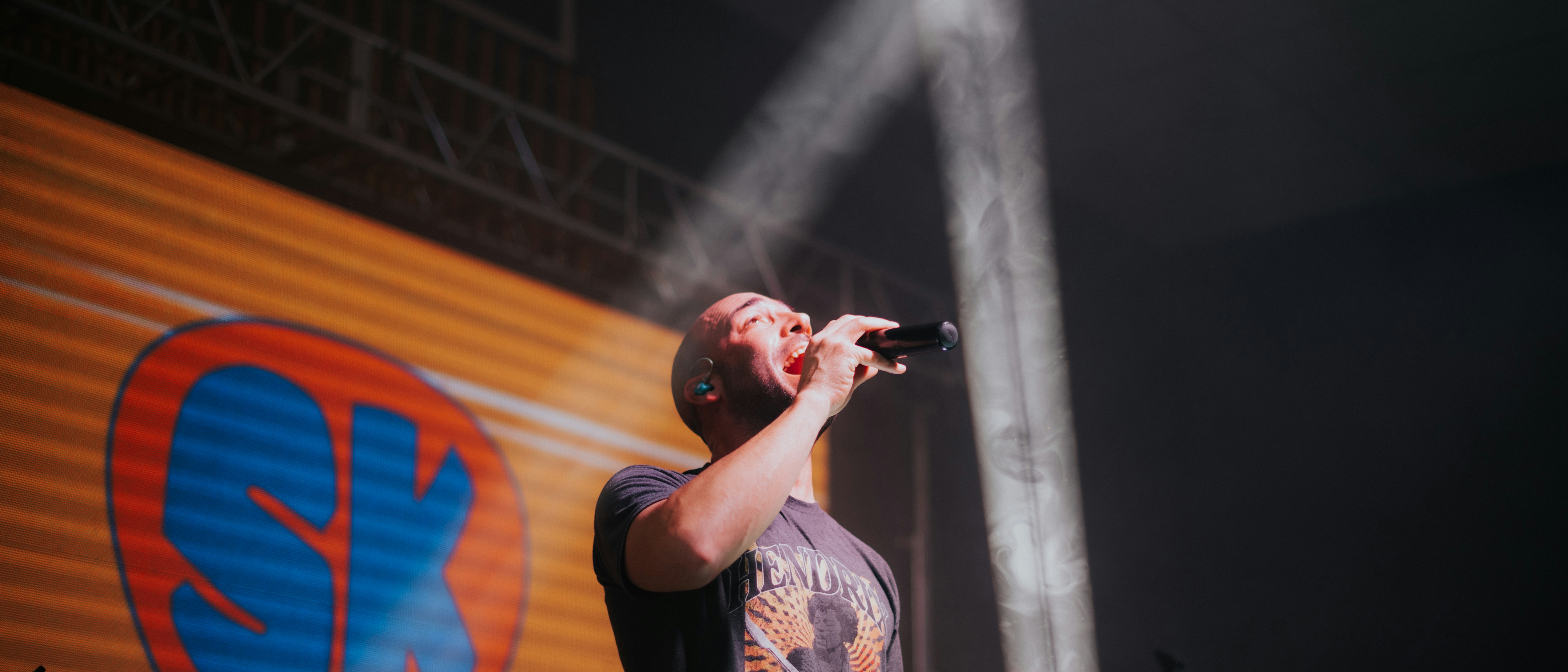 Midnight on Stage: A Vocal Moment Under Neon Light
