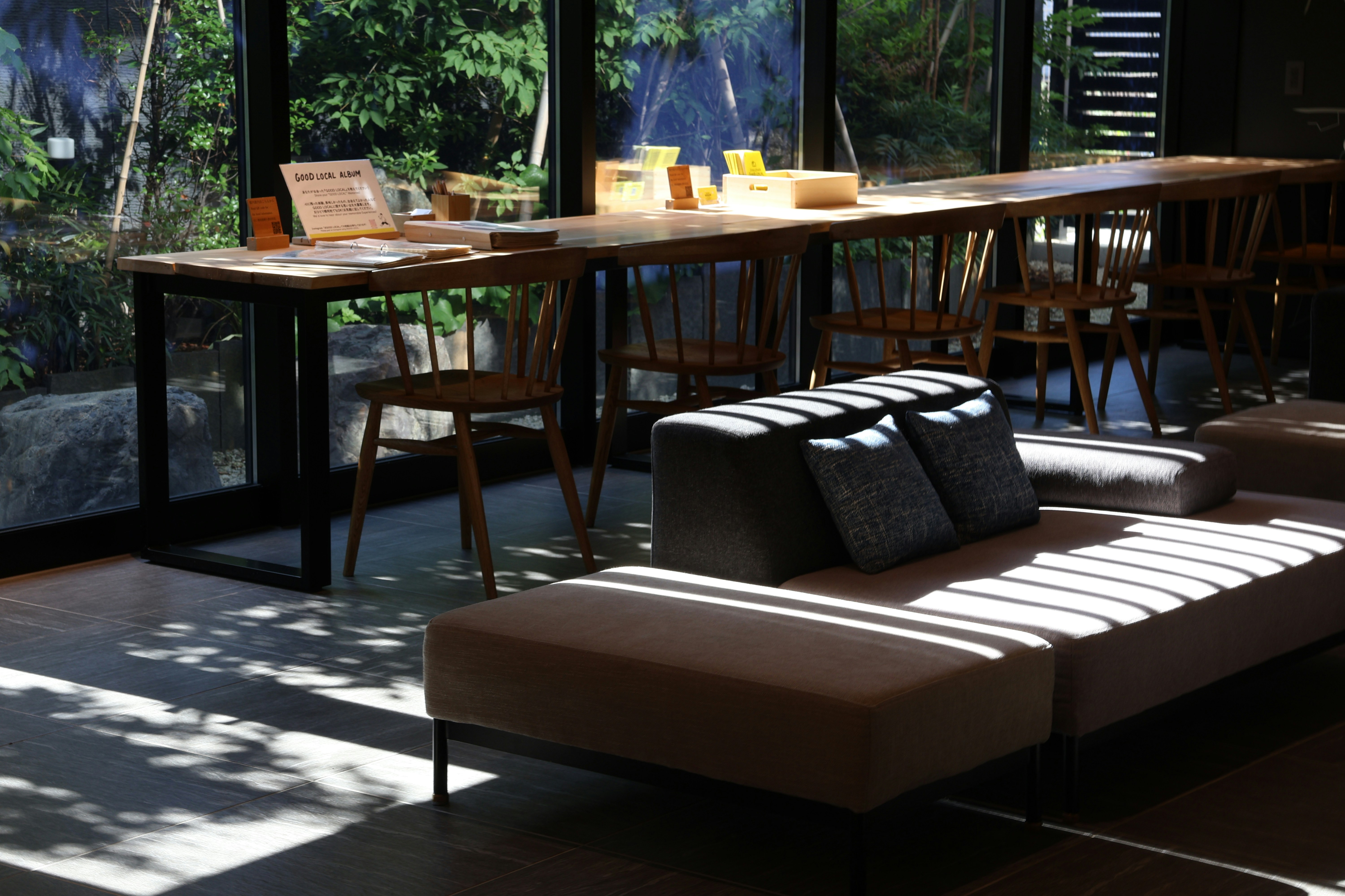 Sunlit Seating: Quiet Corner of a Modern Cafe