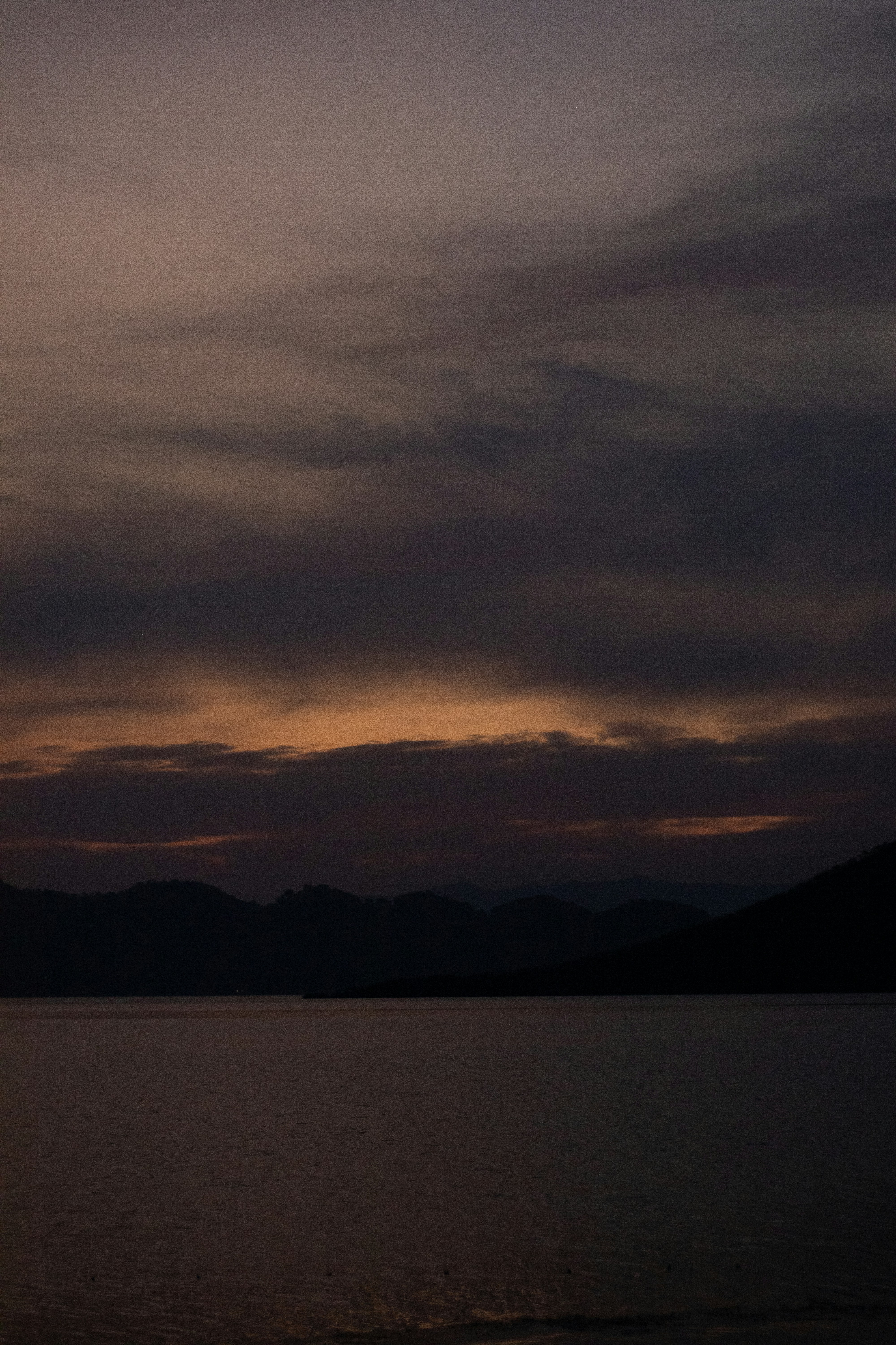 Twilight Over Quiet Waters: Dusk Beneath Gentle Ridges