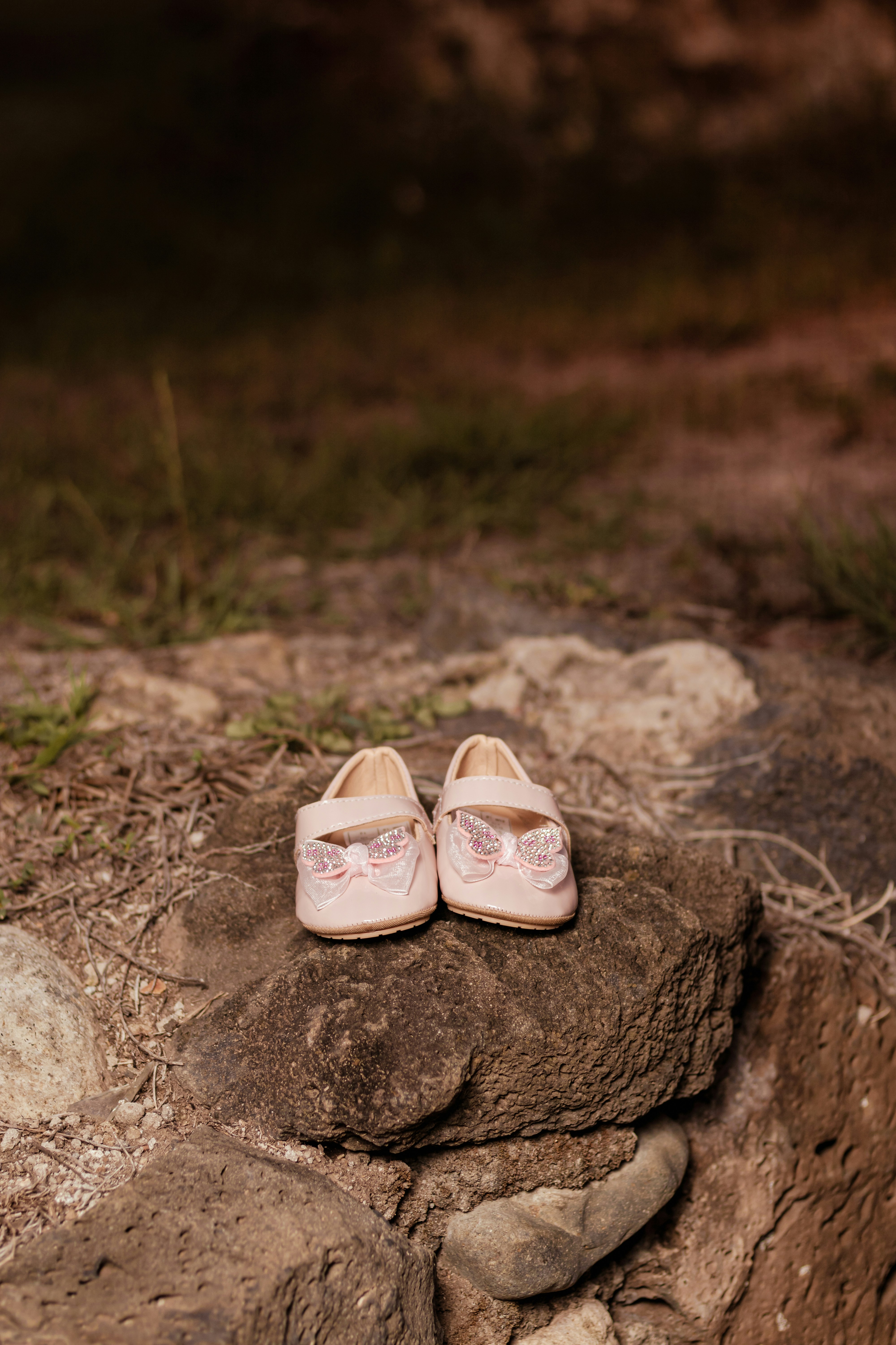 Pastel Shoes on a Stony Step: A Quiet Ground-Level Moment